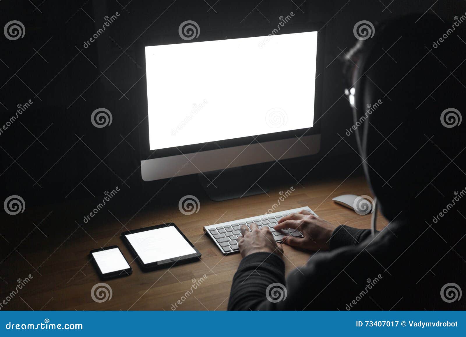 Hacker Using Blank Screen Computer, Tablet and Cell Phone Stock Image ...