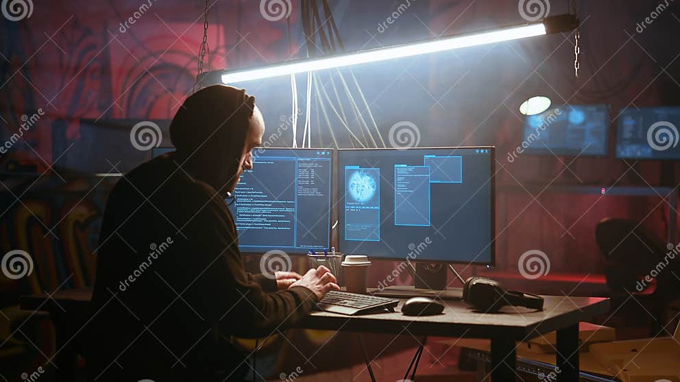 Hacker Using Computer To Run Malicious Code in Foggy Dark Basement ...