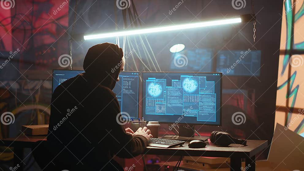 Hacker Using Computer To Run Malicious Code in Foggy Dark Basement ...