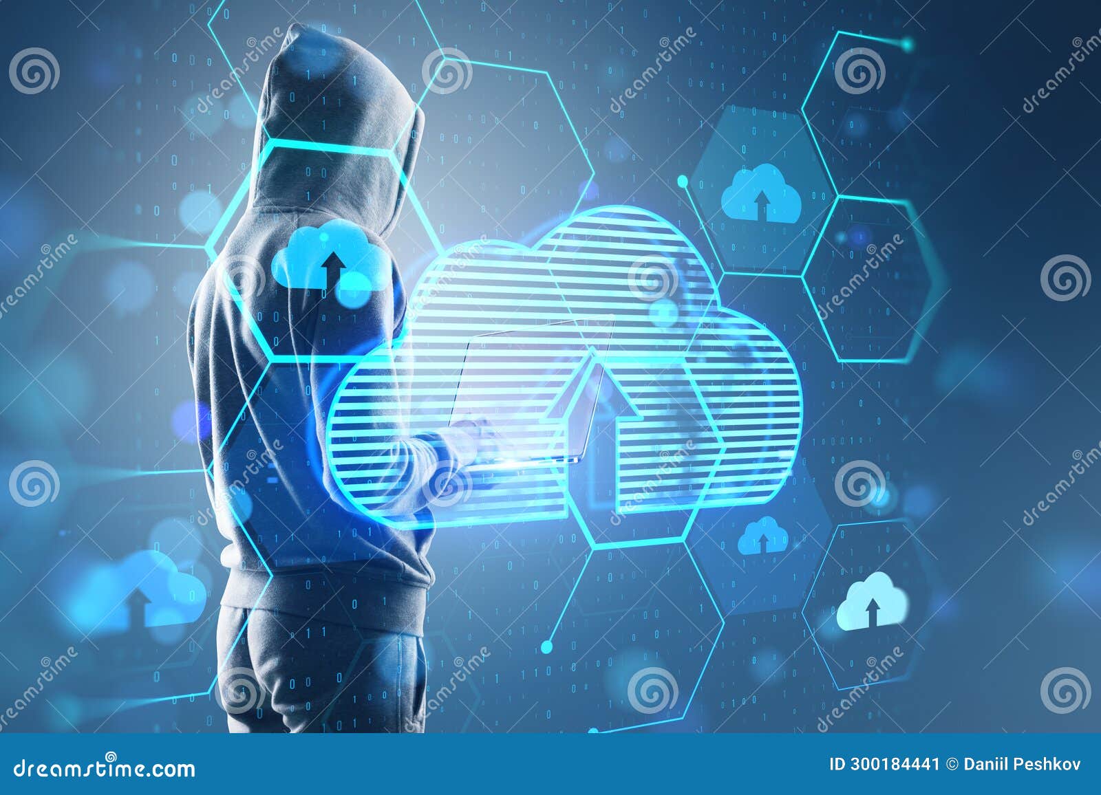 Hacker Using Laptop With Glowing Hexagonal Cloud Computing Hologram With Binary Coding On Blurry