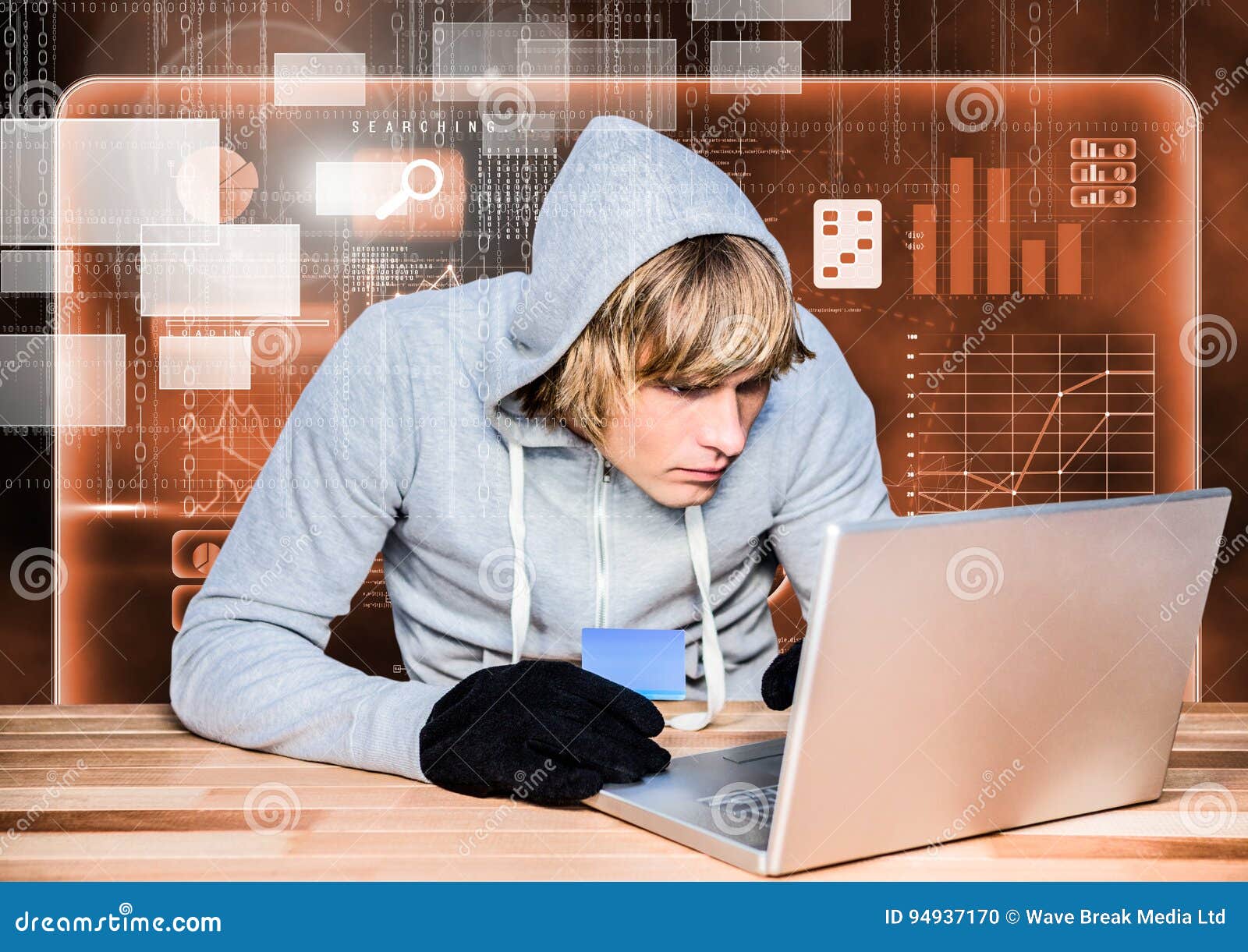 Hacker Using a Laptop and Holding a Credit Card in Front of Digital ...