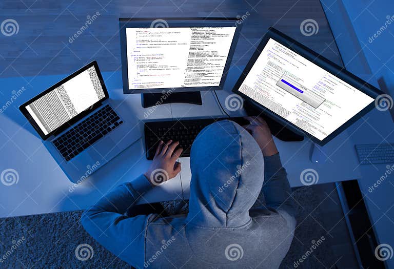 Hacker Using Multiple Computers To Steal Data Stock Photo - Image of ...
