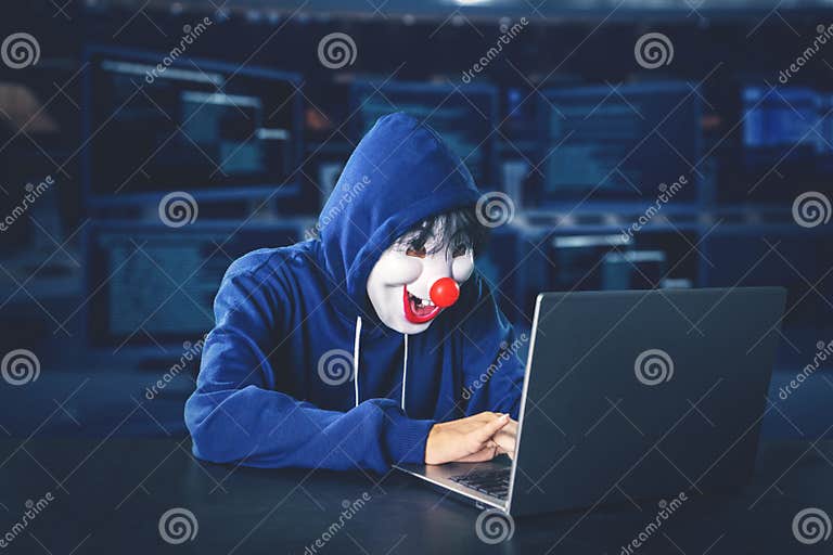 Hacker Wearing Clown Mask Working Stock Image - Image of hoodie, male ...