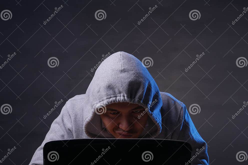 Hacker Wearing Grey Hoodie Using Laptop Computer Stock Photo - Image of ...
