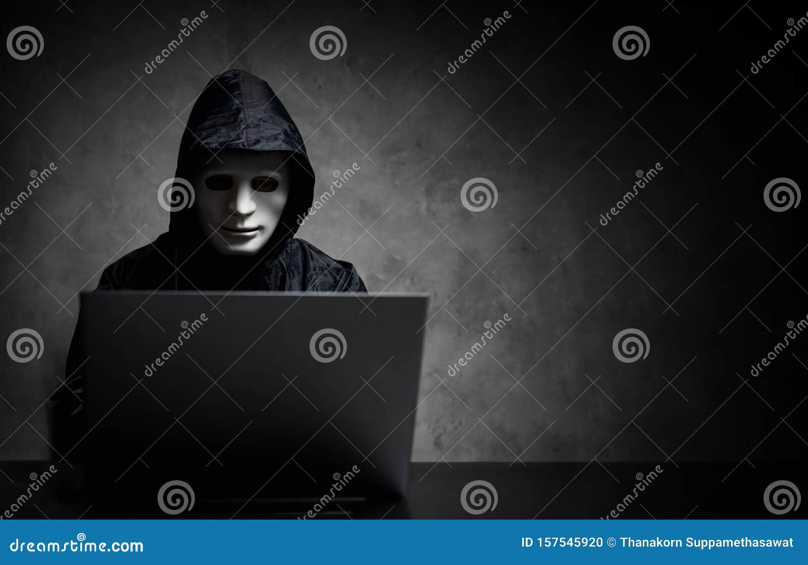 Hacker Wearing a White Mask in Front of His Computer. Hacker Hacks ...