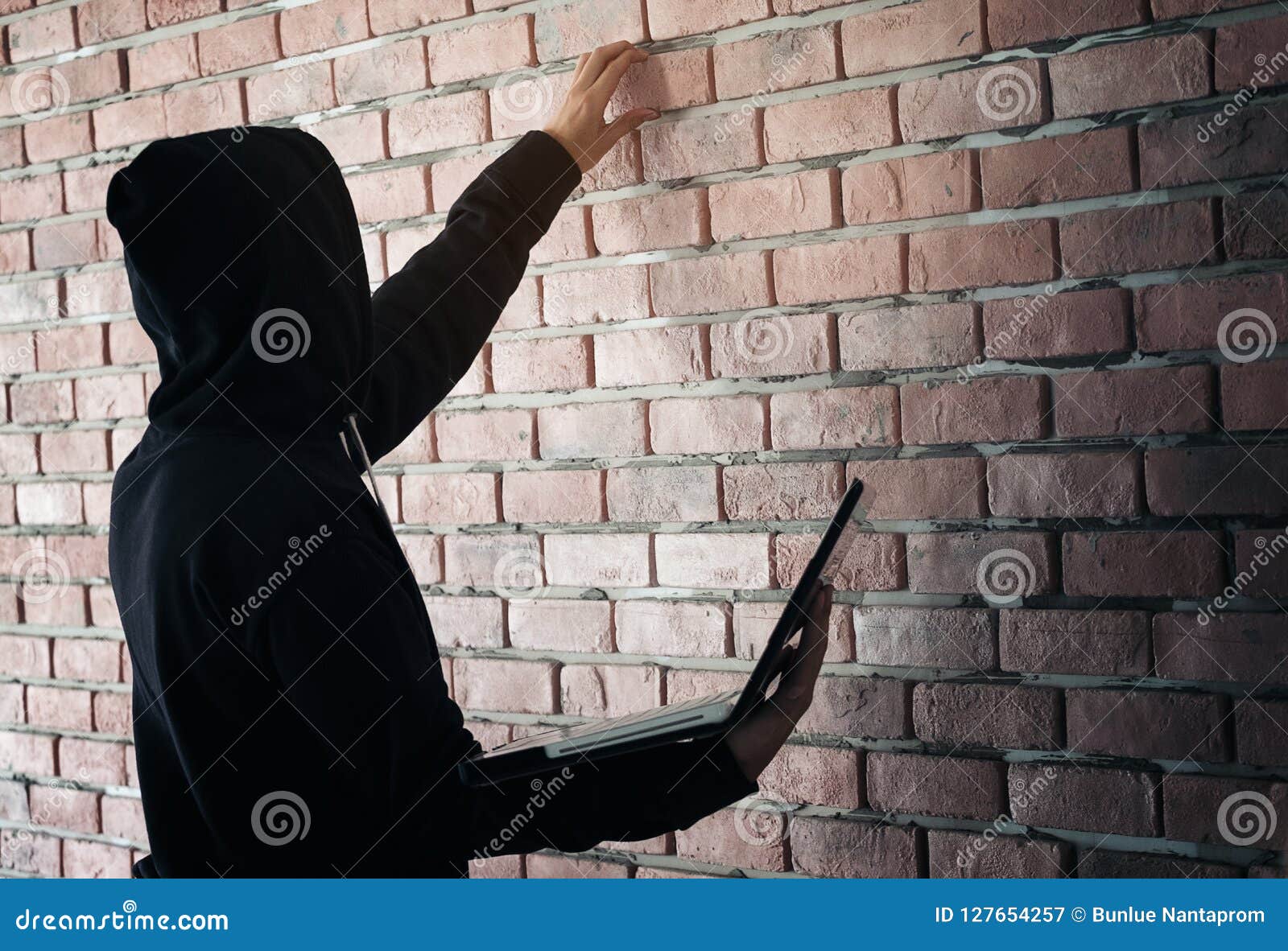 Hacker Working on His Computer. Black Masked Hacker in the Black Stock ...