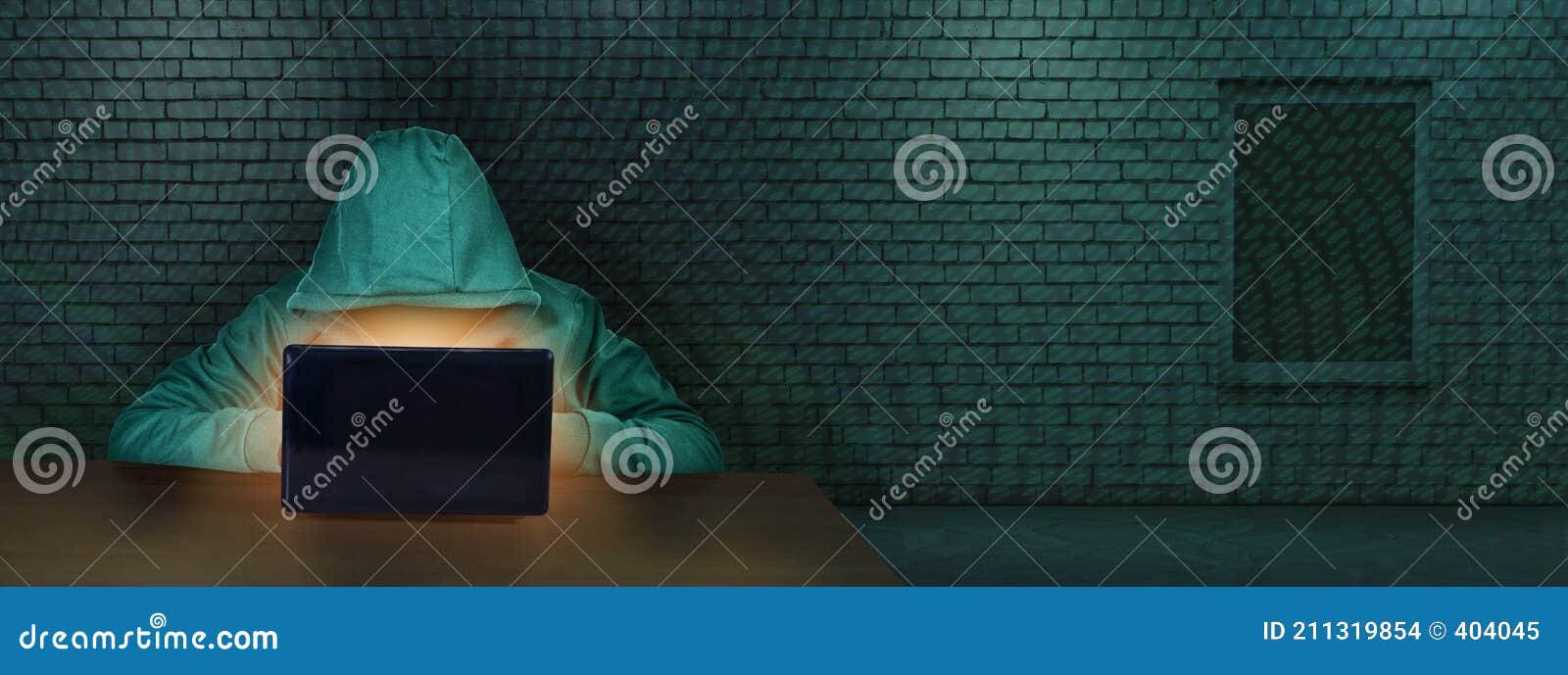 The Hacker Works Behind a Laptop Screen in a Room with a Brick Wall ...