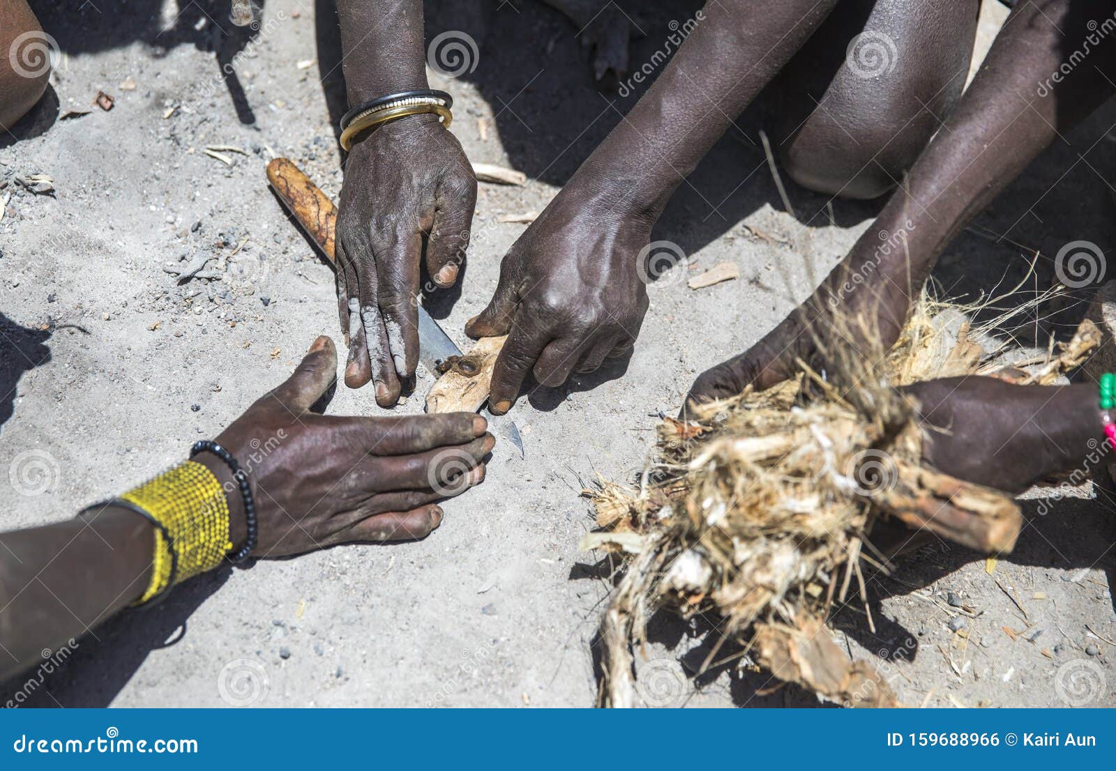 Hadzabe men making fire stock photo. Image of male, people - 159688966