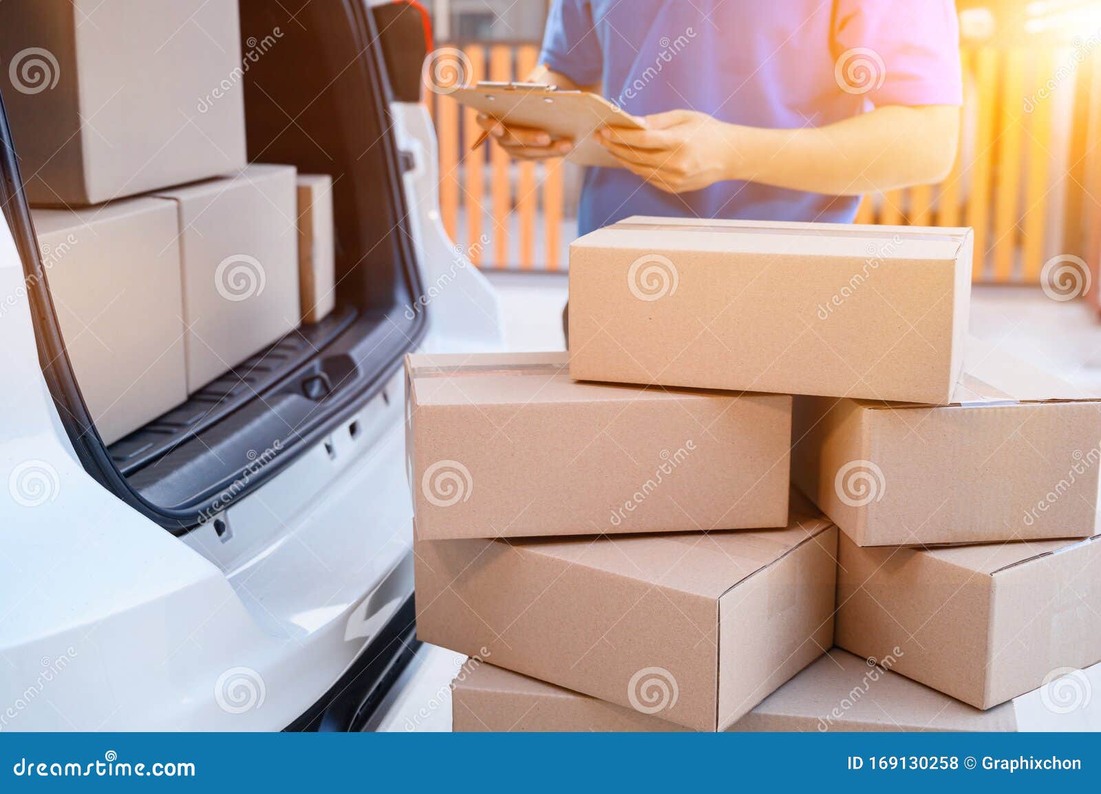 Hai Mailman Checking Parcel and Mail Boxes for Home Delivery. Stock ...