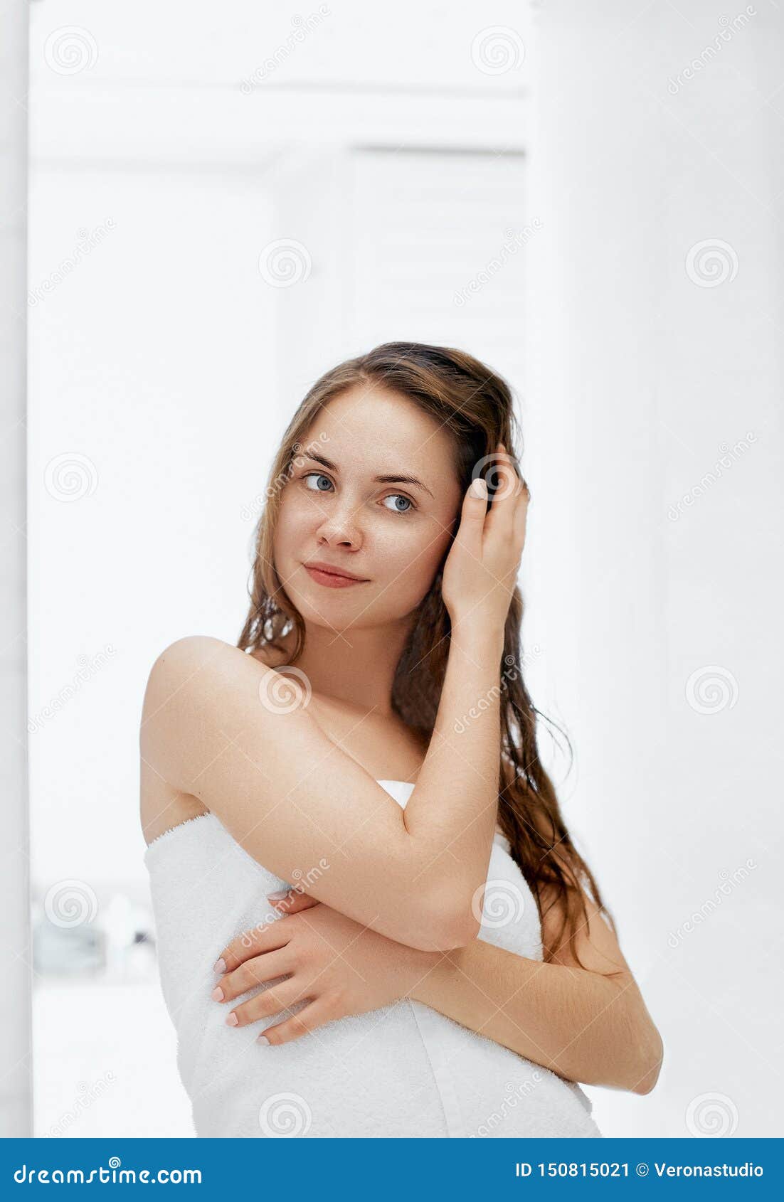 Hair And Body Care Woman Touching Wet Hair And Smiling While Looking