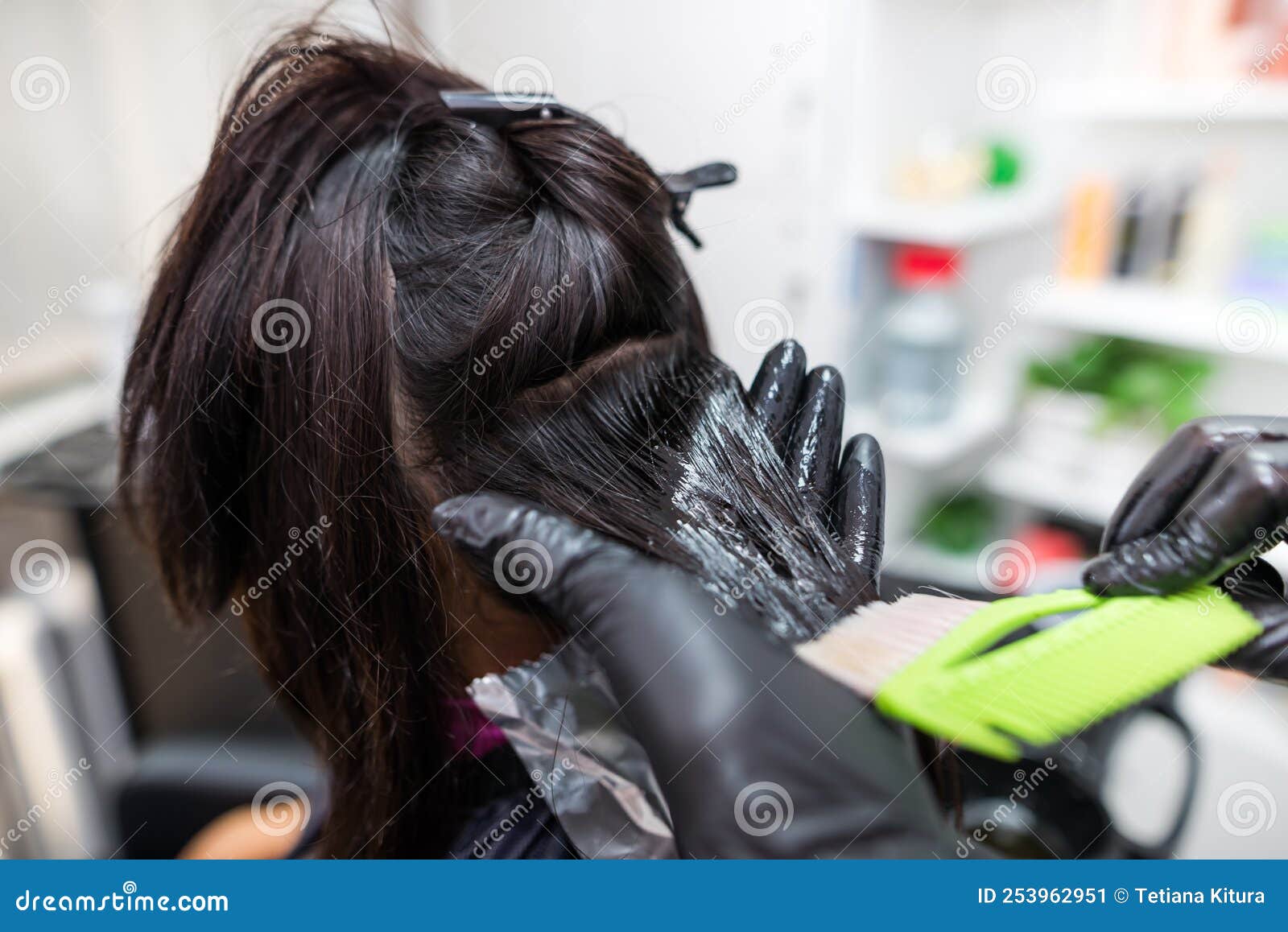 The Hairdresser Applies Professional Liquid Keratin To The Client`s