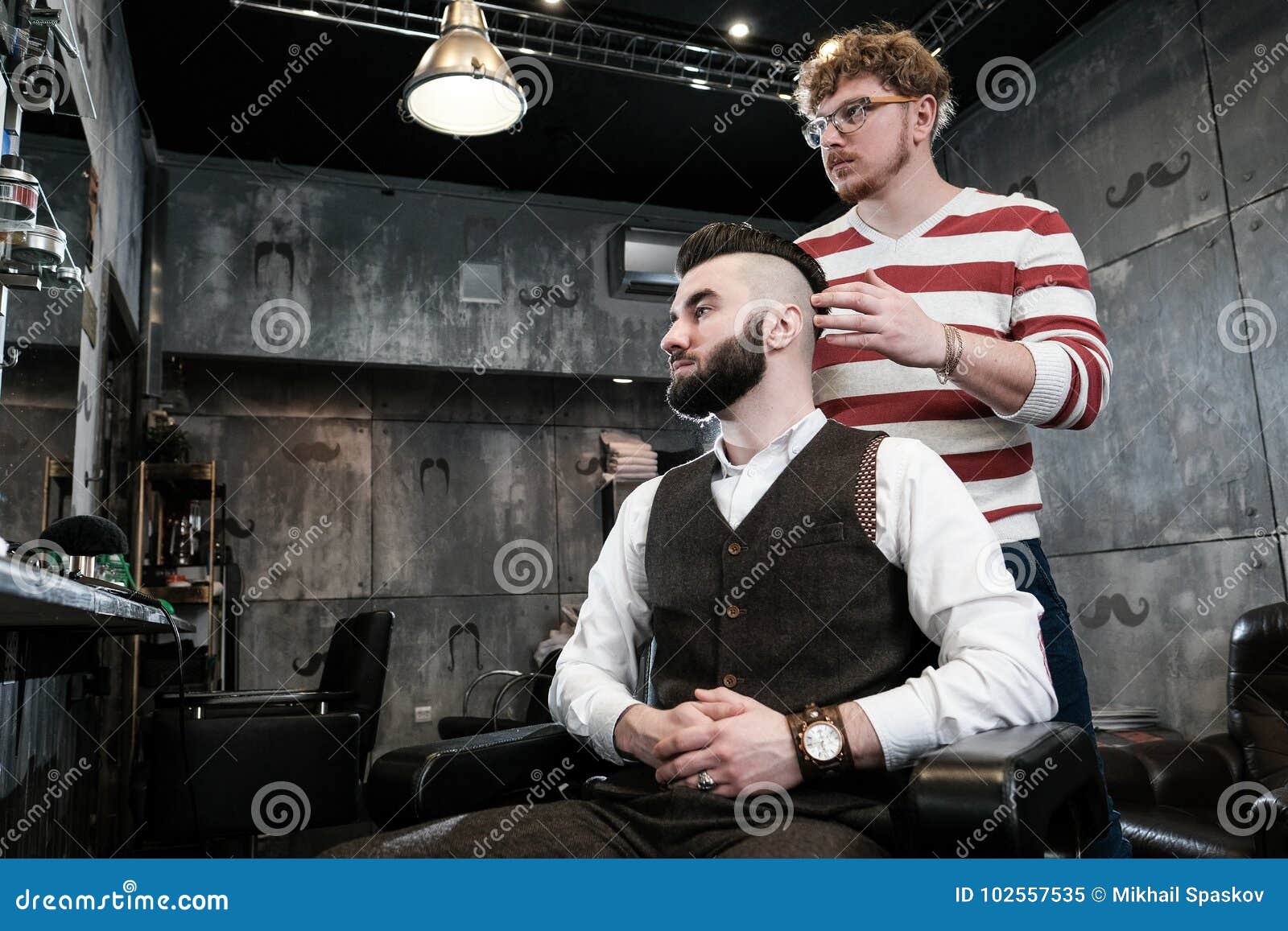 Hairdresser Man Shaves a Client with a Beard in a Barbershop Stock ... Hairdresser Man Shaves a Client with a Beard in a Barbershop Stock ...