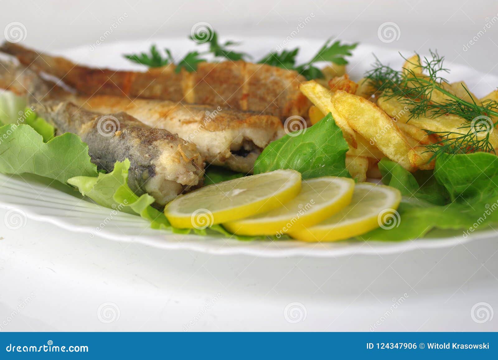 Hake fish on plate stock photo. Image of greens, fishing - 124347906