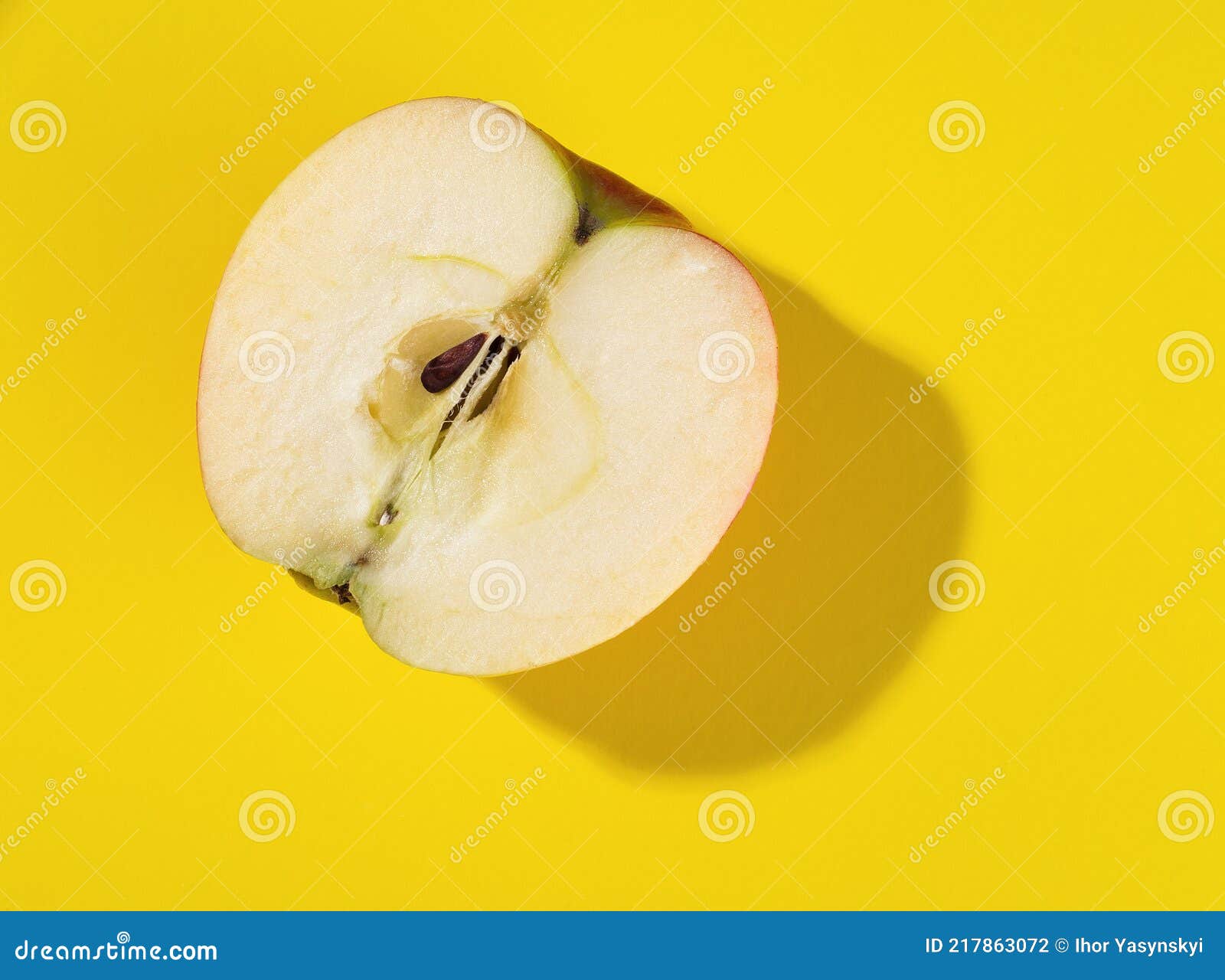 Half of an Apple of the Correct Form on Yellow. Stock Photo - Image of ...