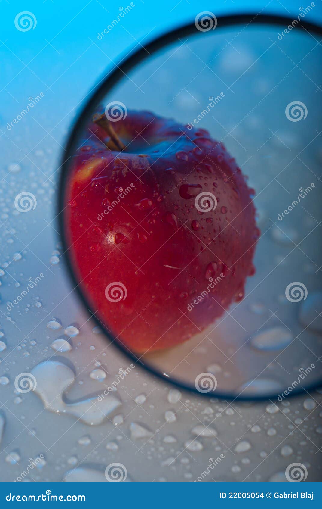 Half Apple Under Magnifying Glass Stock Photo - Image of loupe, drops ...