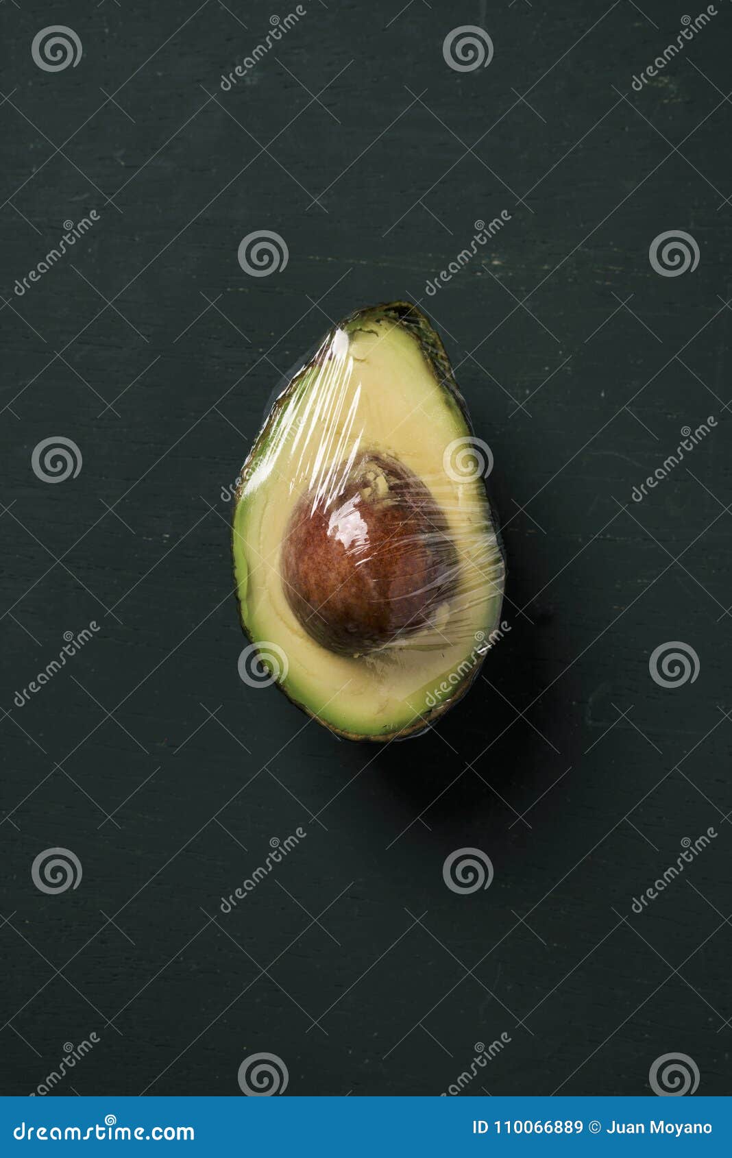 Half Avocado Wrapped in Plastic Wrap Stock Image - Image of copy, empty ...