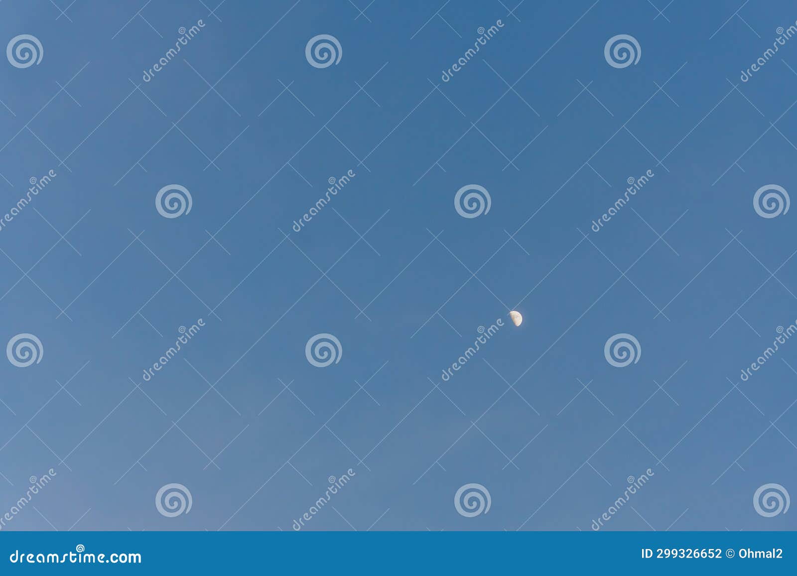 Half Bright Moon in the Middle of the Blue Sky Background Stock Photo ...