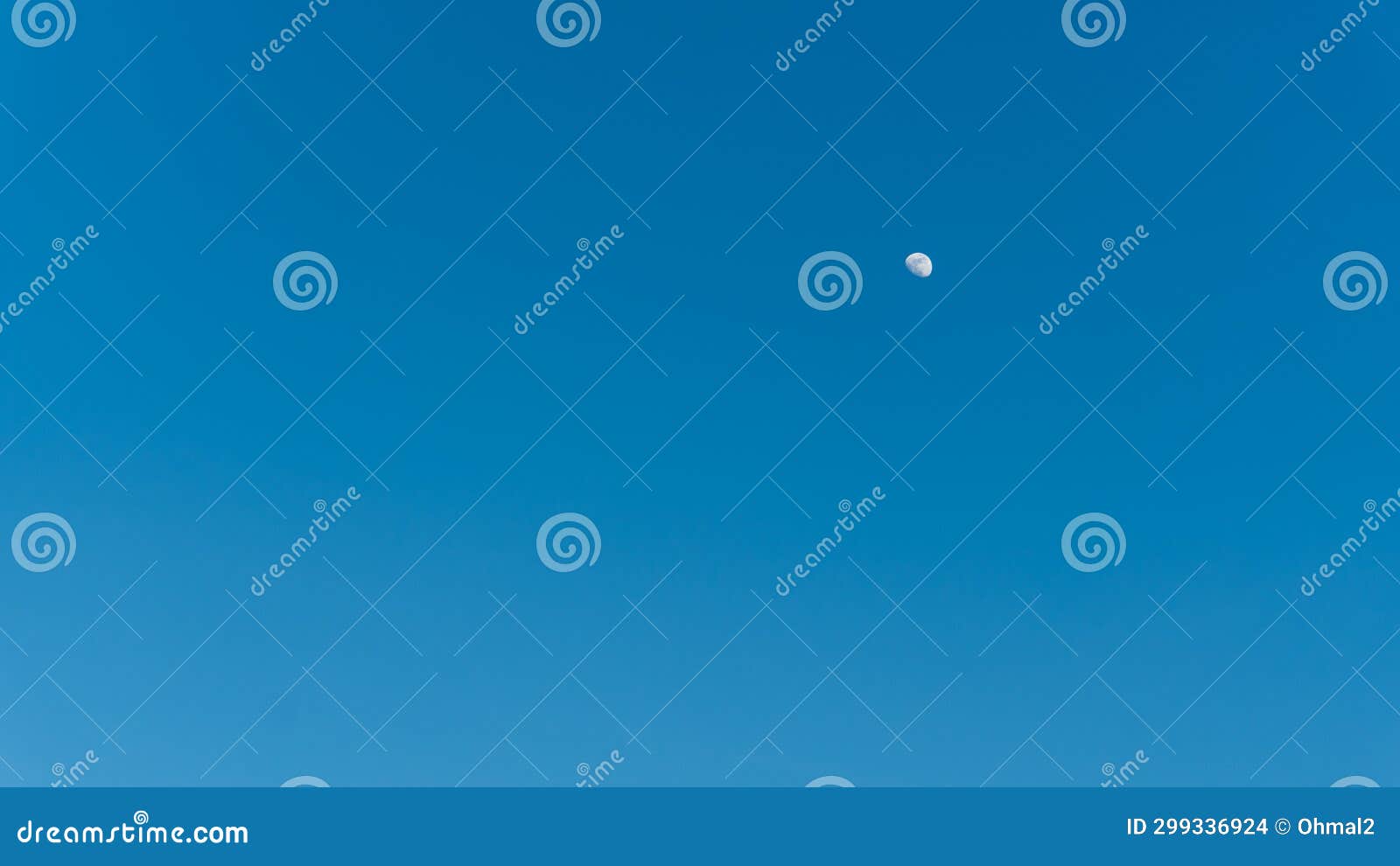Half Bright Moon in the Middle of the Blue Sky Background Stock Photo ...