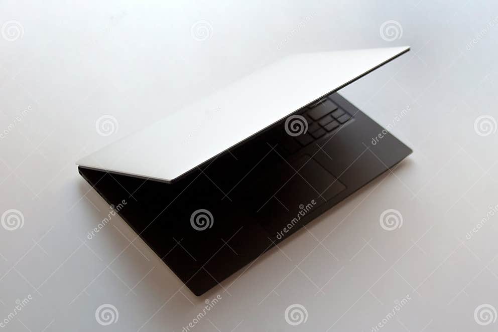 Half Closed Laptop on White Background Stock Image - Image of abstract ...