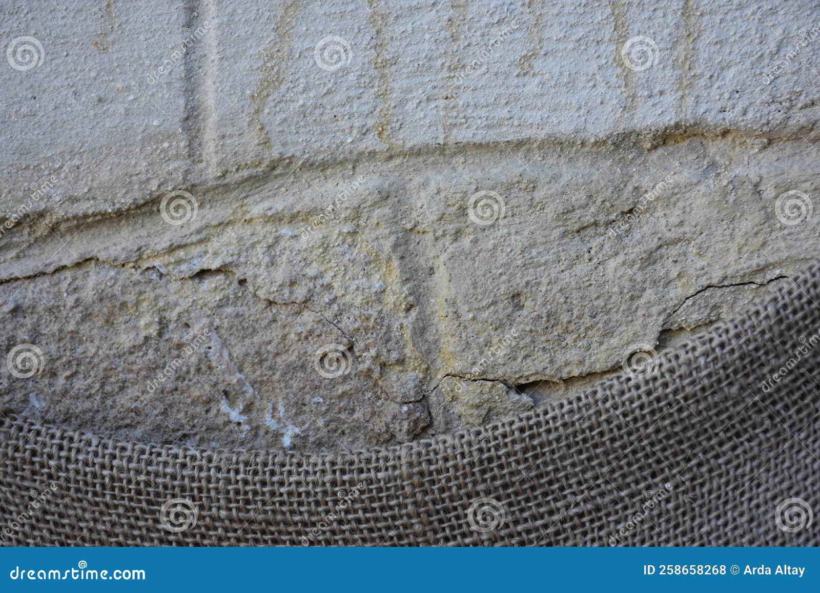 A Half Covered Sack on a Stone Wall, Dramatic Surface View. Stock Photo ...