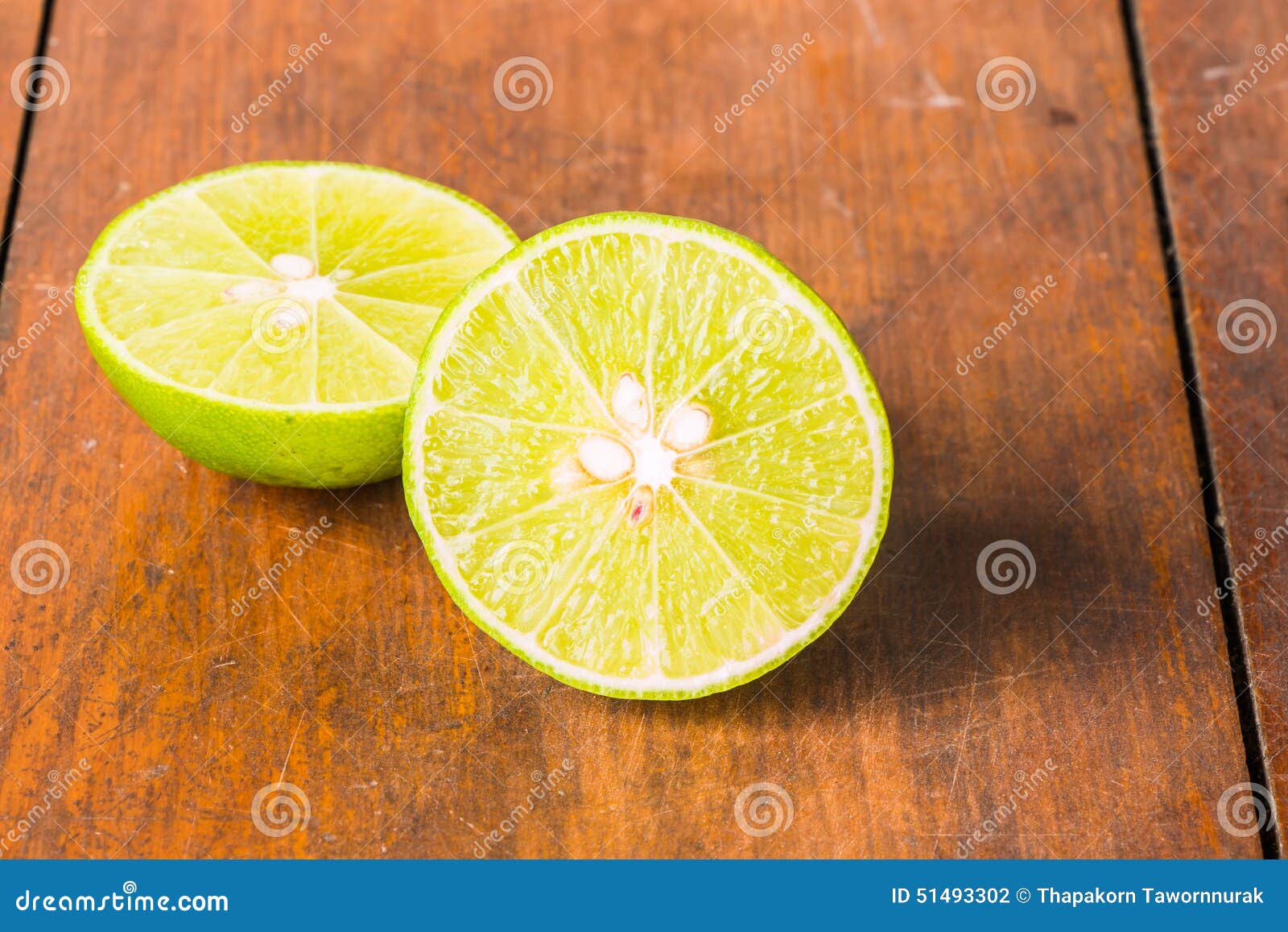Half cut lime stock photo. Image of lime, slice, wood - 51493302