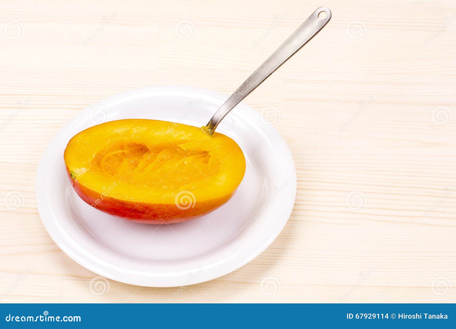 Half cut mango stock photo. Image of summer, tableware - 67929114
