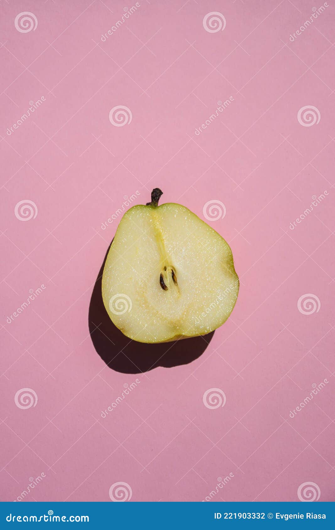 Half of the Cut Yellow Pear on a Pastel Pink Background. Half Pear ...