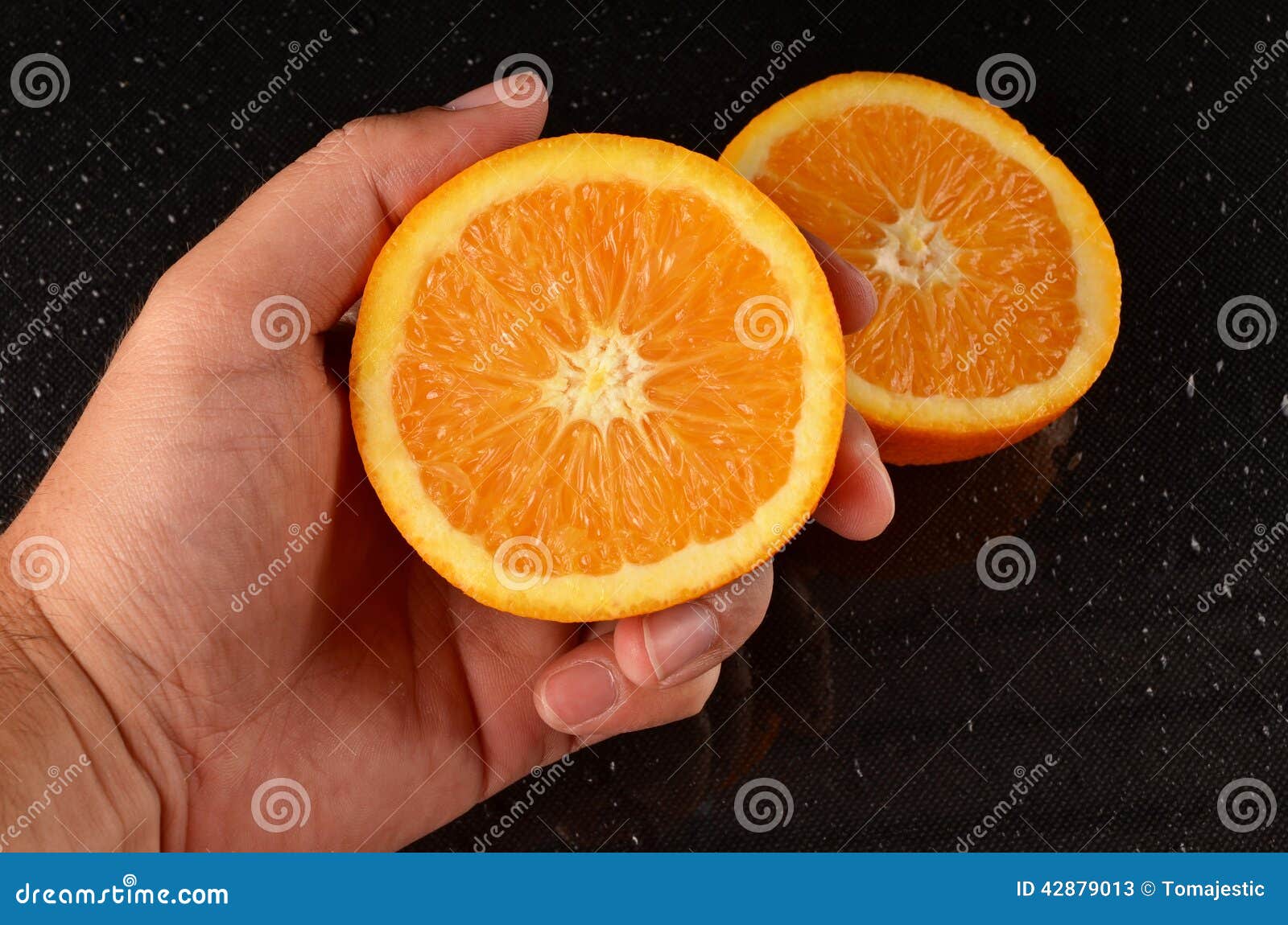 Half cutted orange stock image. Image of finger, healthy - 42879013