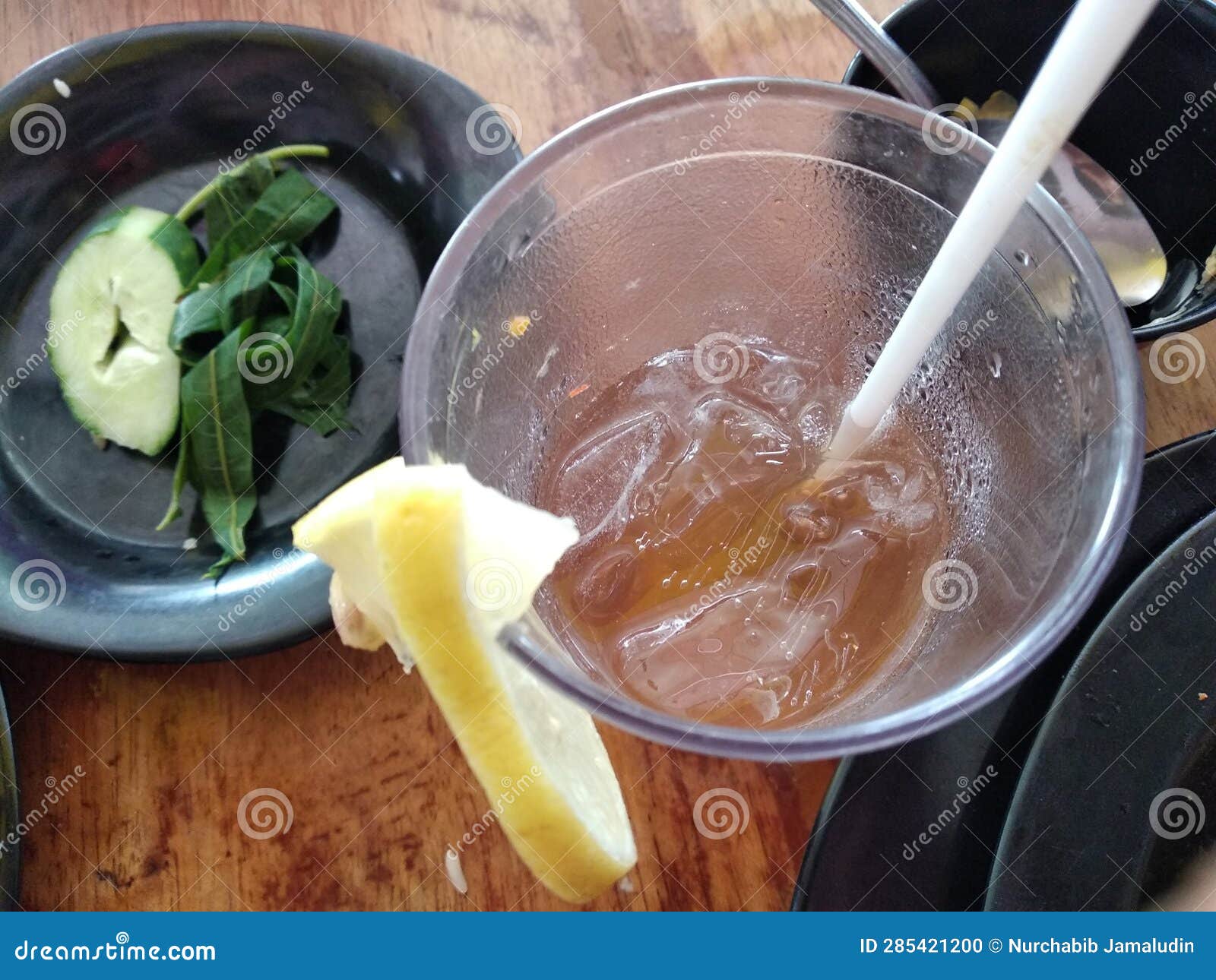 Half-drunk Iced Tea on a Wooden Table Stock Photo - Image of cool ...