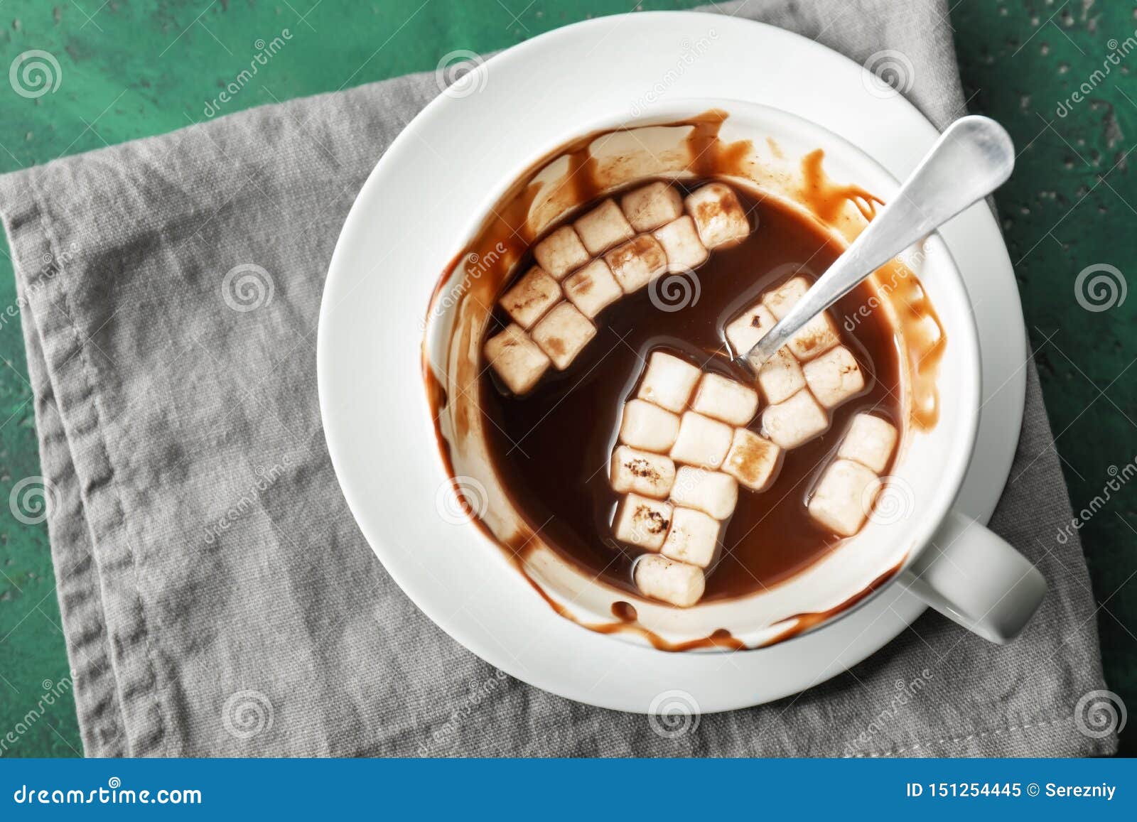 Half Empty Cup of Hot Chocolate with Marshmallows on Color Table Stock ...