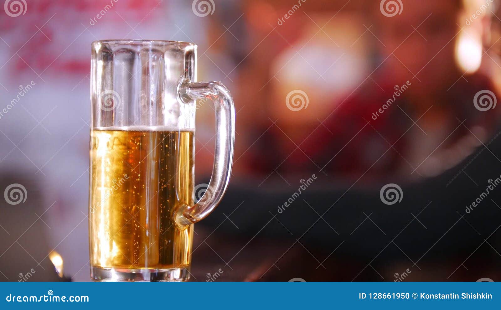 Half Empty Pint of Beer in Focus. Talking Guys at the Background Stock ...