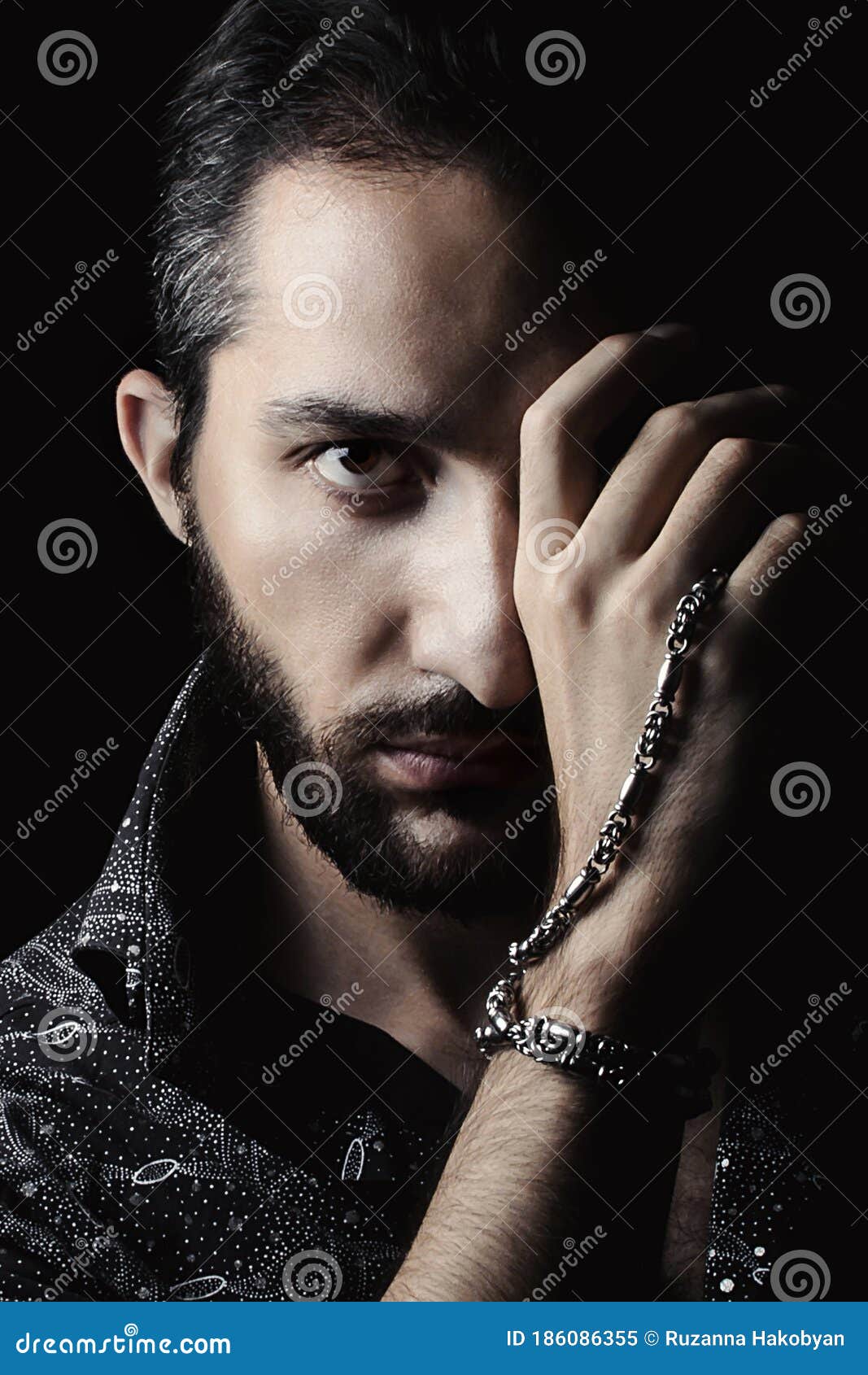 Only Half of the Face is Lit. the Hand Covers Half the Face. on the ...