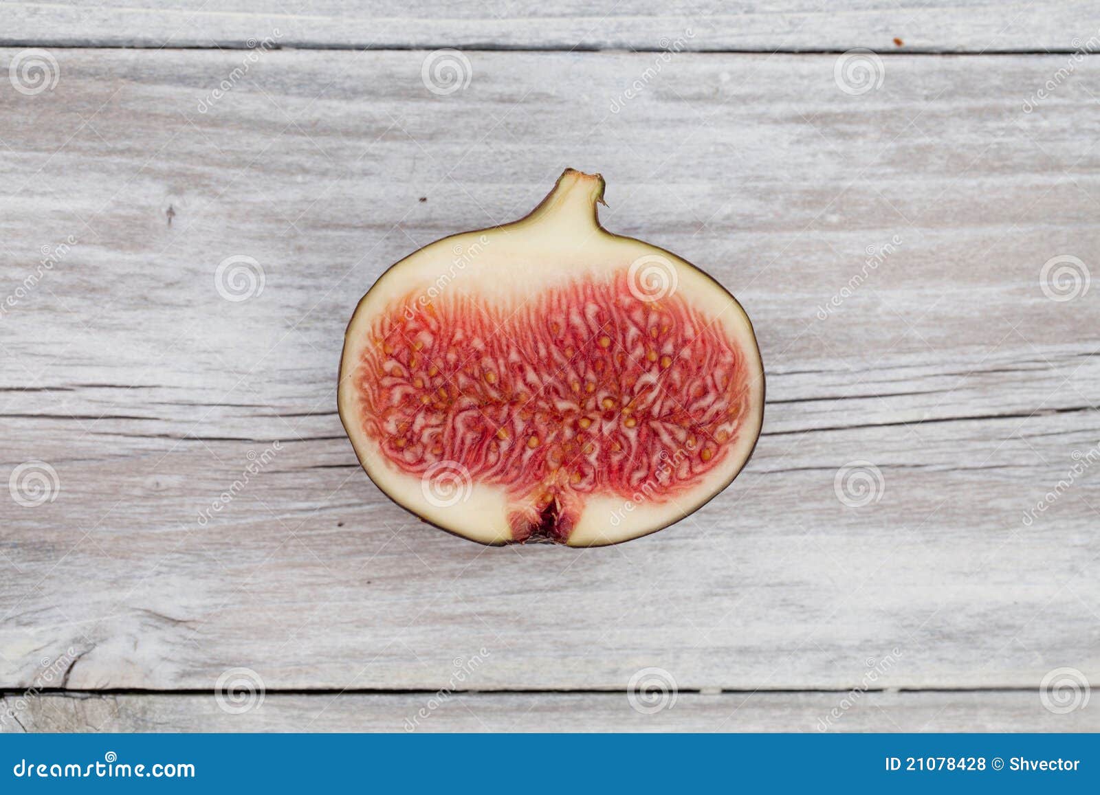 A Half Fig Lying on a Rustic Table Stock Photo - Image of close, fresh ...