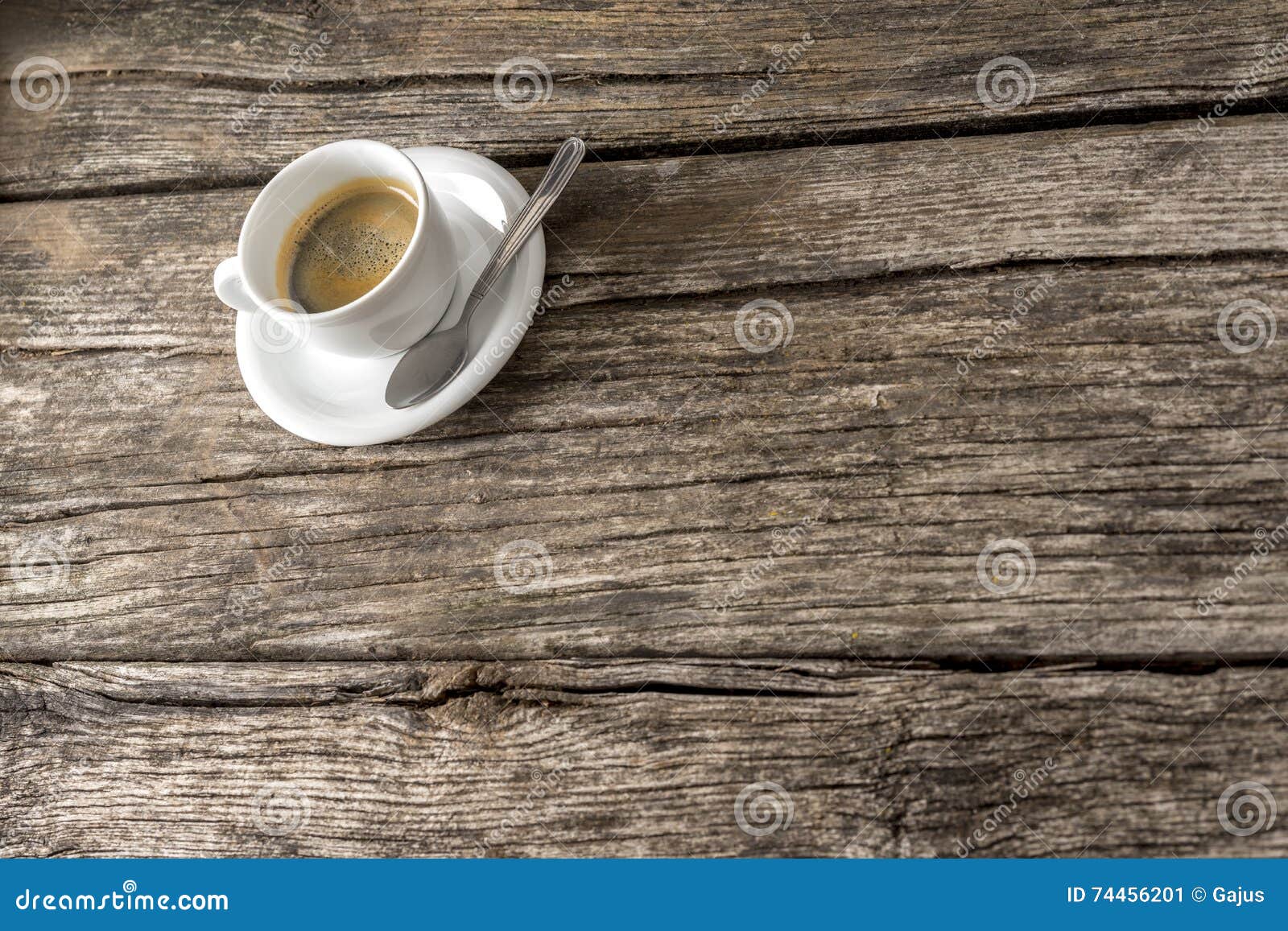 Half Full Cup of Coffee with Spoon on Wooden Table Stock Image - Image ...