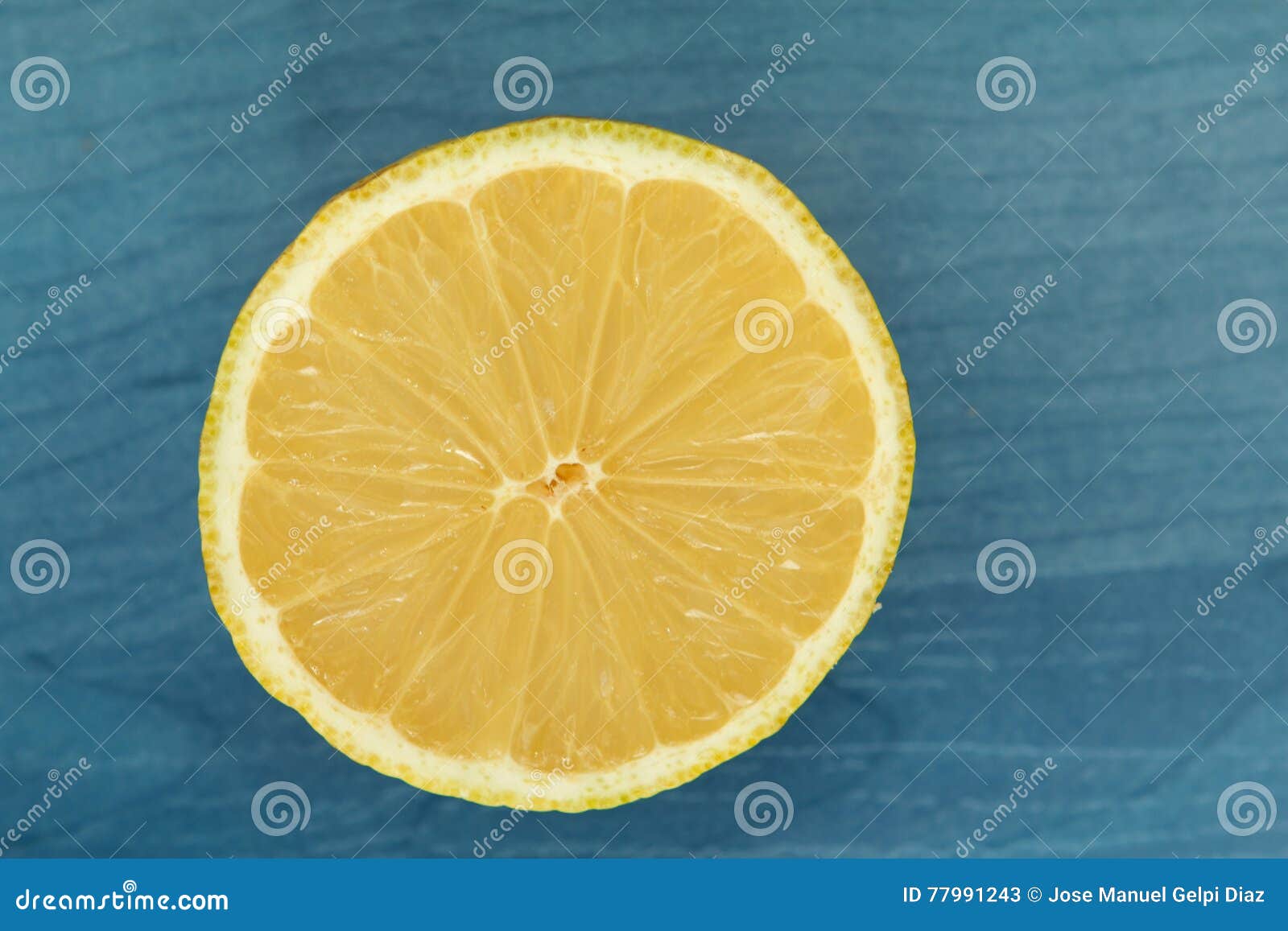 Half lemon on a blue wood stock image. Image of fruit - 77991243