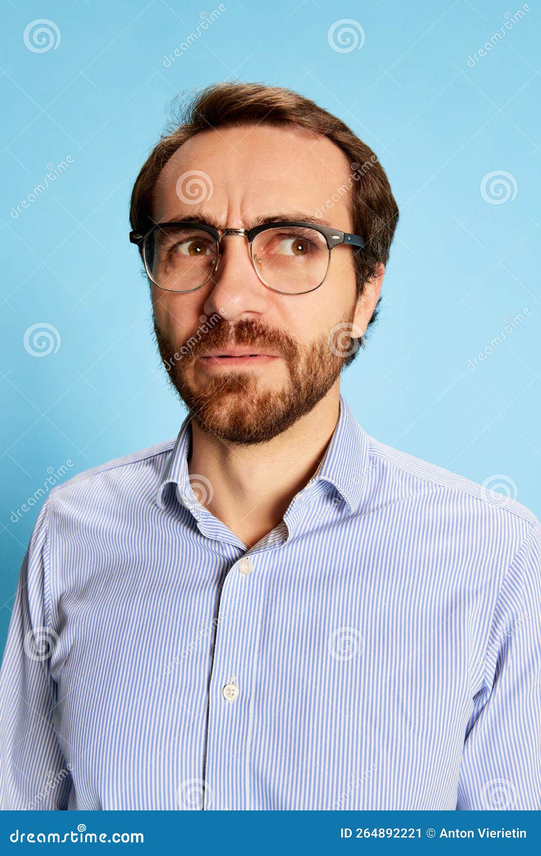 Half Length Portrait Of Mature Bearded Man In Eyewear Expressing Vivid