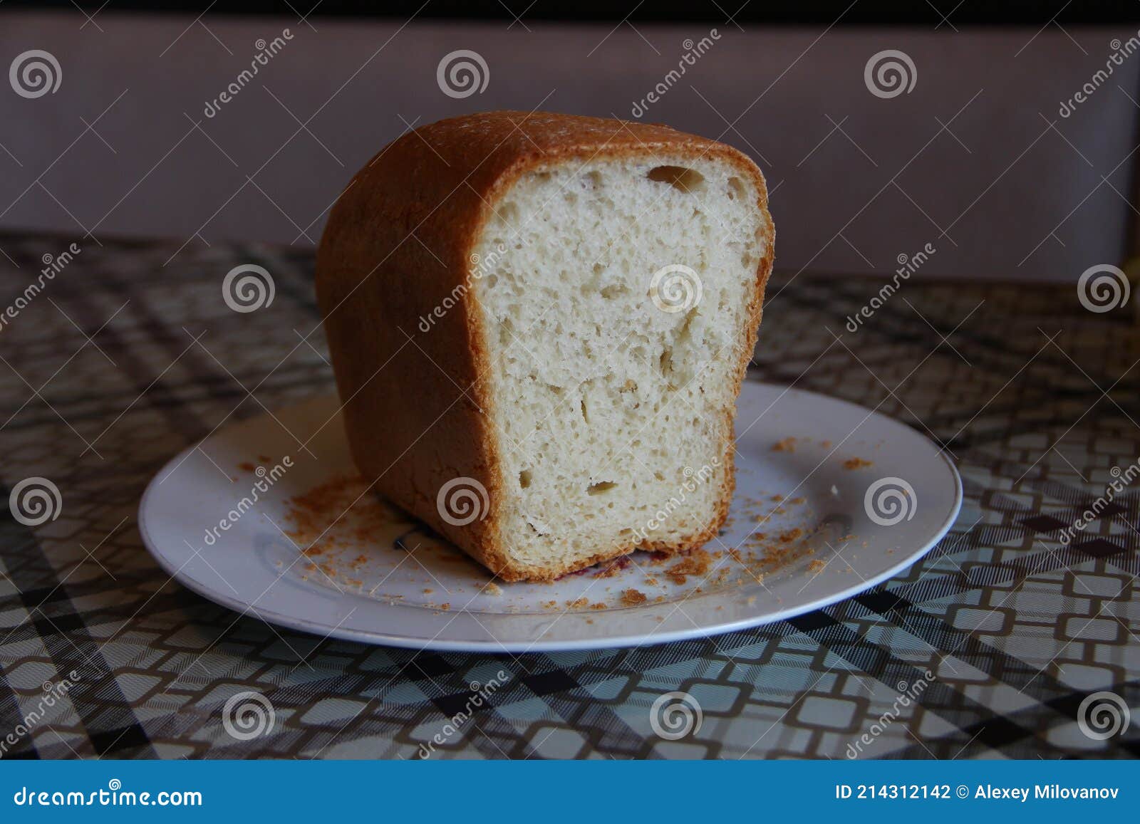 Half Loaf of Bread on a Plate Stock Photo - Image of crumbs, bread ...