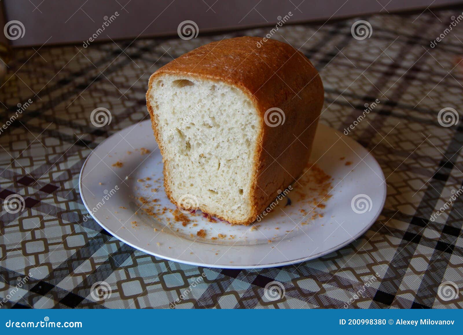 Half Loaf of Bread on a Plate Stock Photo - Image of homemade, flour ...