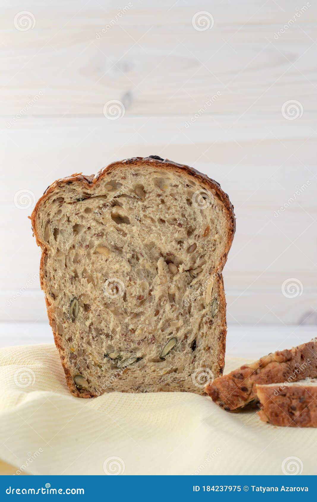 Half Loaf of Bread with Seeds, Sliced Bread with Crust on Wooden Table ...