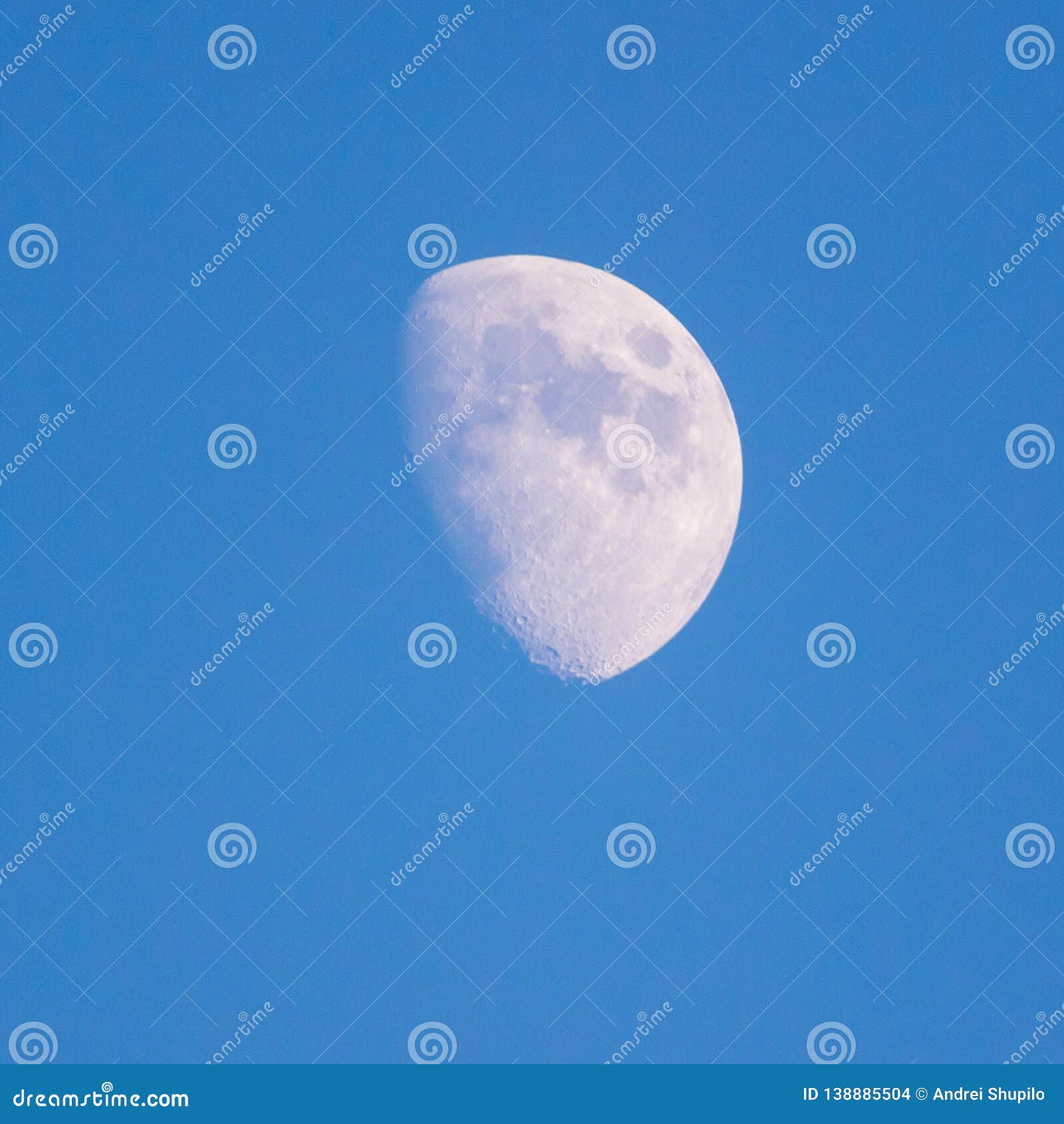 Half Moon Against a Blue Sky at Sunset Stock Photo - Image of moonlight ...