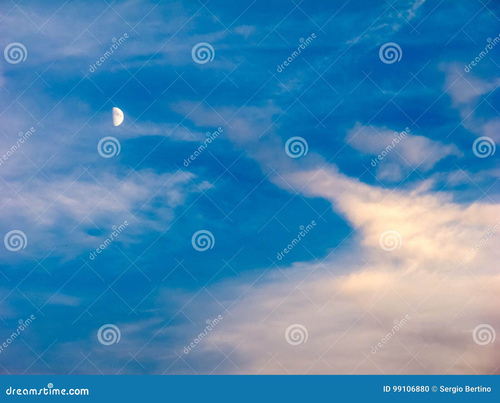 Half Moon in a Blue Cloudy Sky Stock Photo - Image of clouds, blue ...