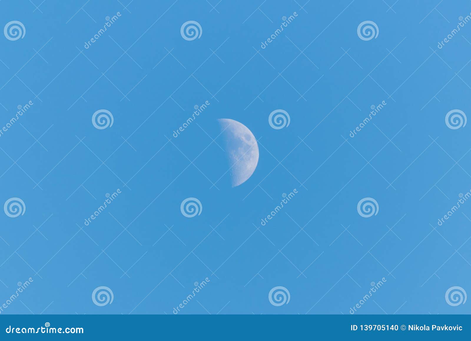 Half Moon on a Clear Blue Sky Stock Photo - Image of daytime, light ...