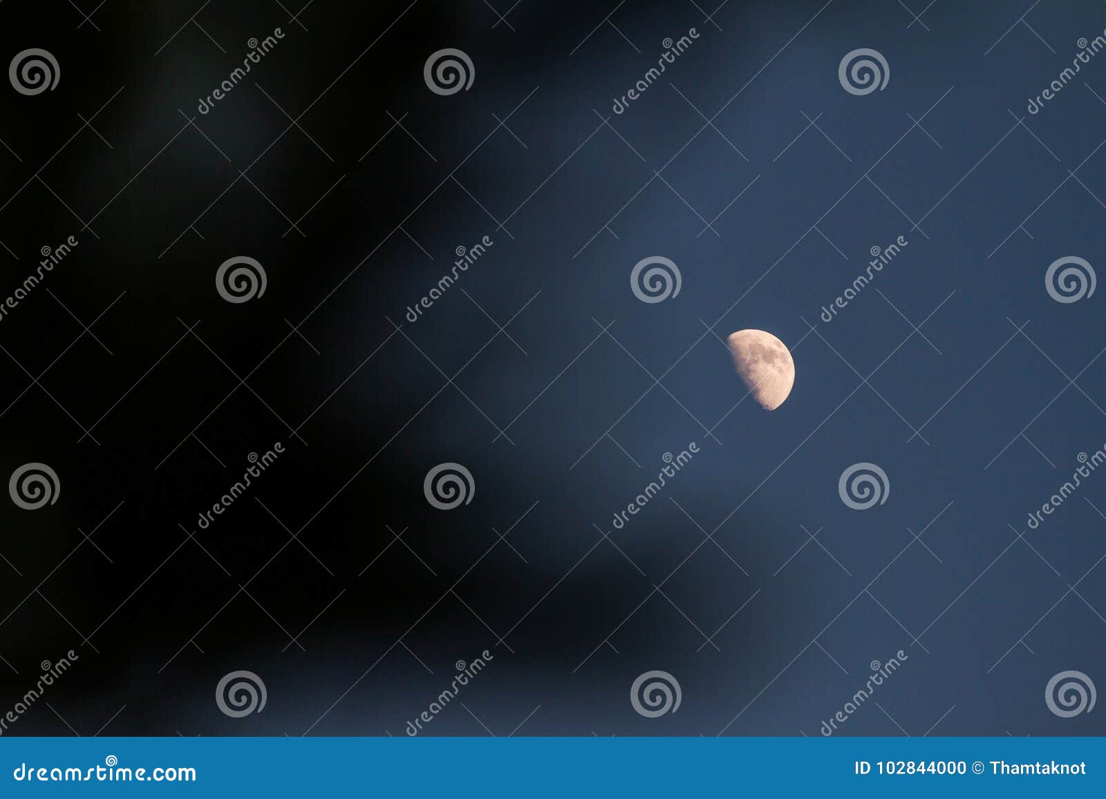 Half Moon in the Sky Blue, and Clouds of Black As the Background. Stock ...