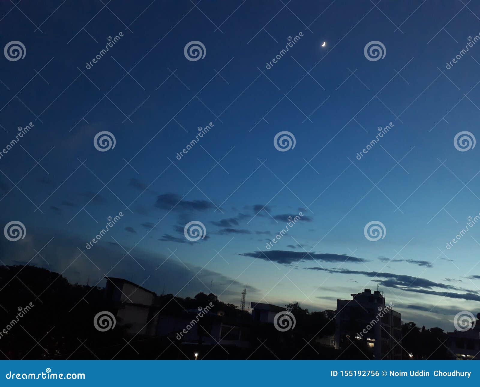 Half Moon Visible in the Sky.and Building are in Lighting Looking so ...