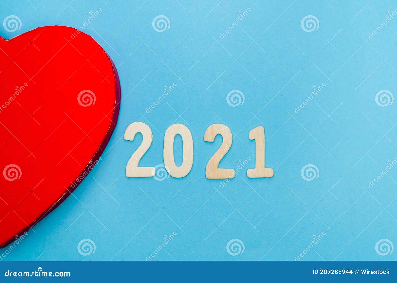 Half Red Heart with 2021 Near it on a Blue Background Stock Photo ...