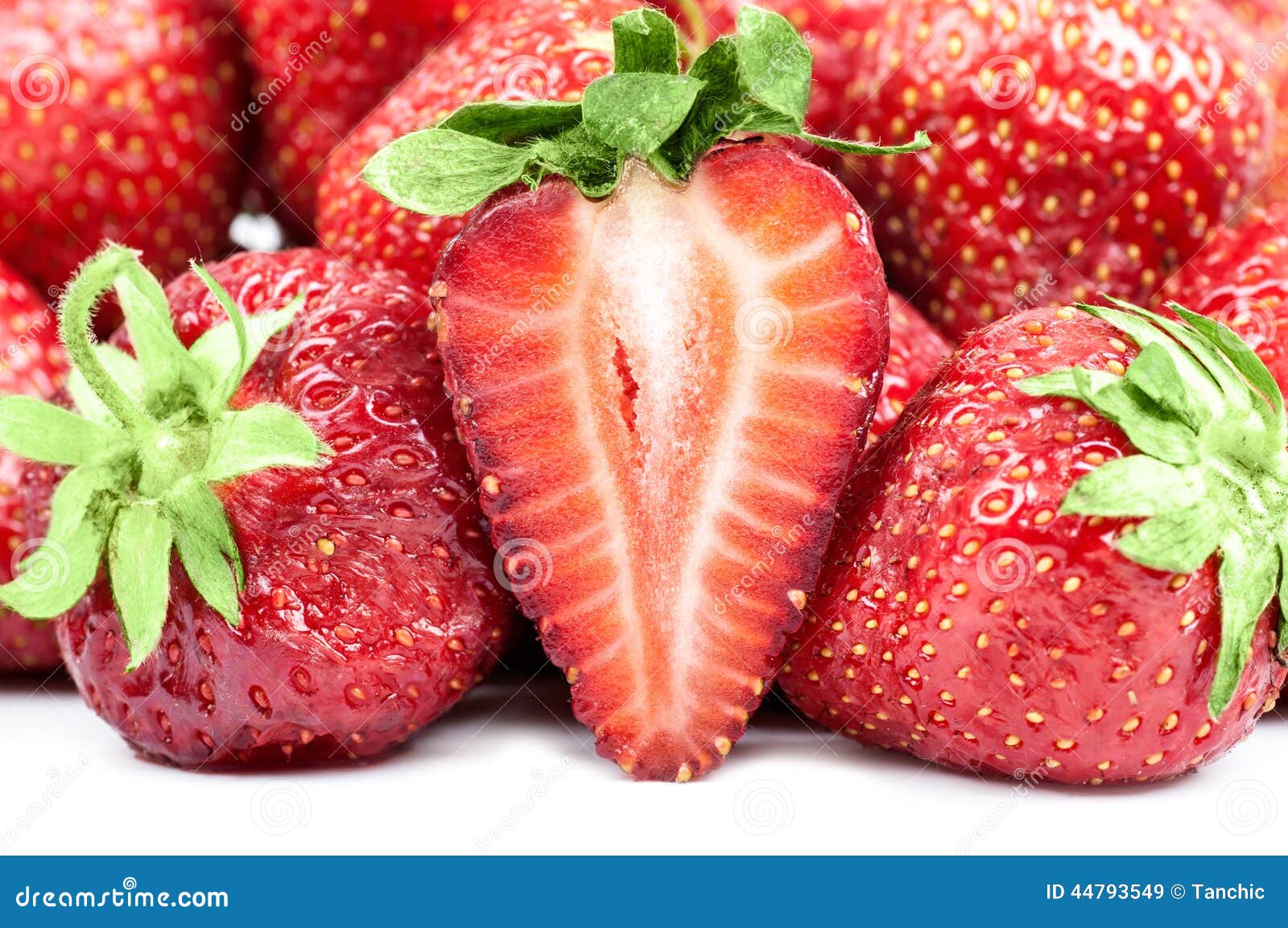 Half Strawberry Next To Whole Berries Stock Image - Image of slice ...