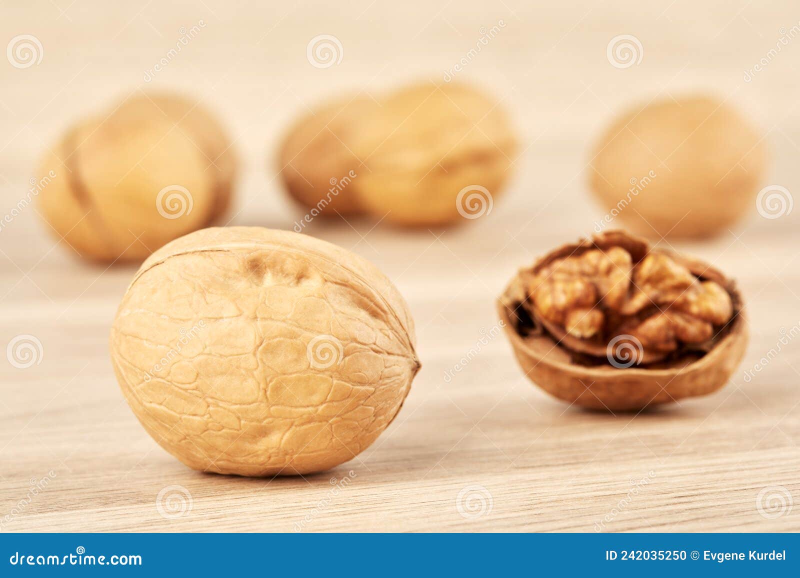 Half a Walnut Next To a Whole Nut in the Foreground Stock Photo - Image ...