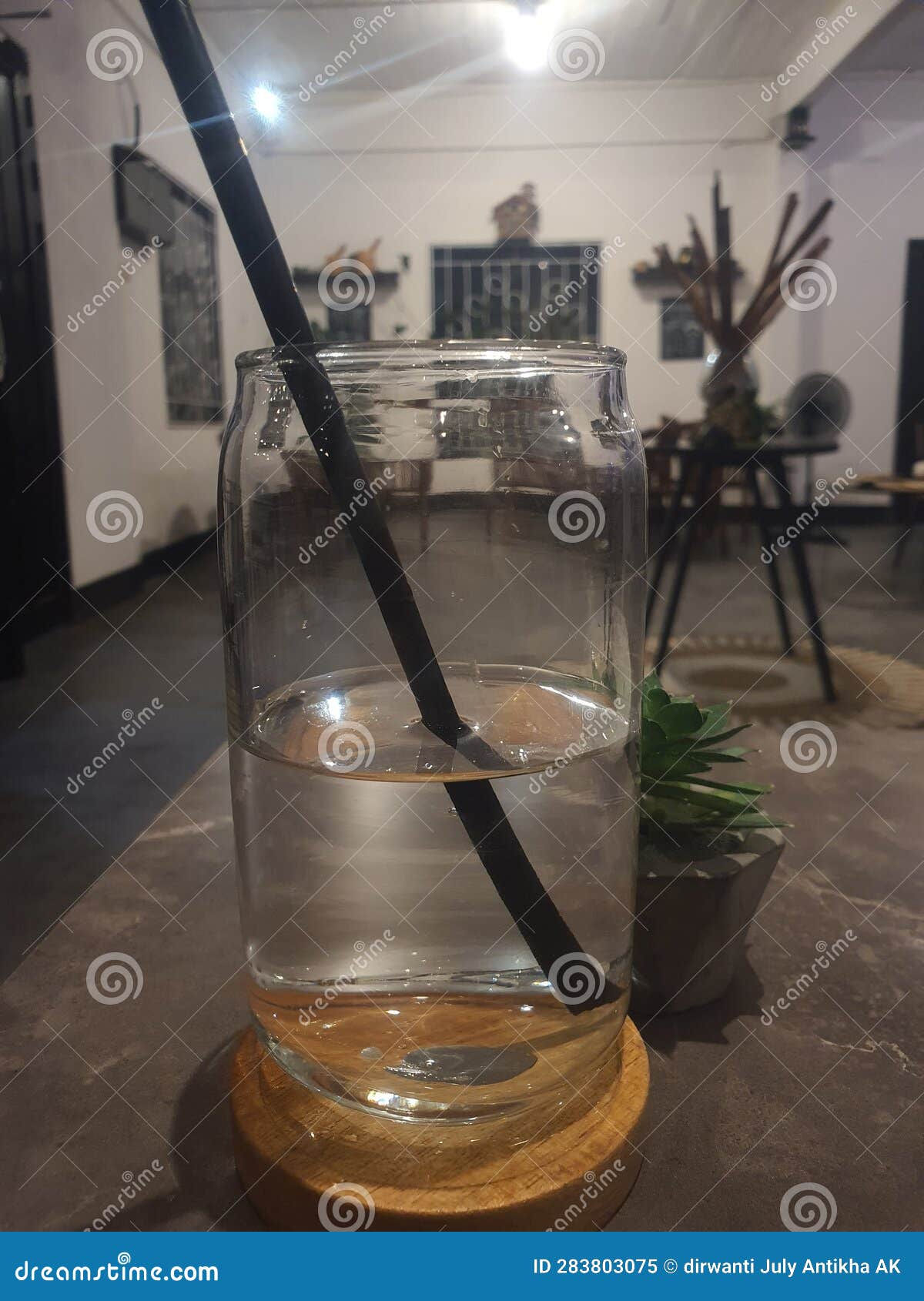 Half water in glass stock image. Image of straw, aesthetic - 283803075