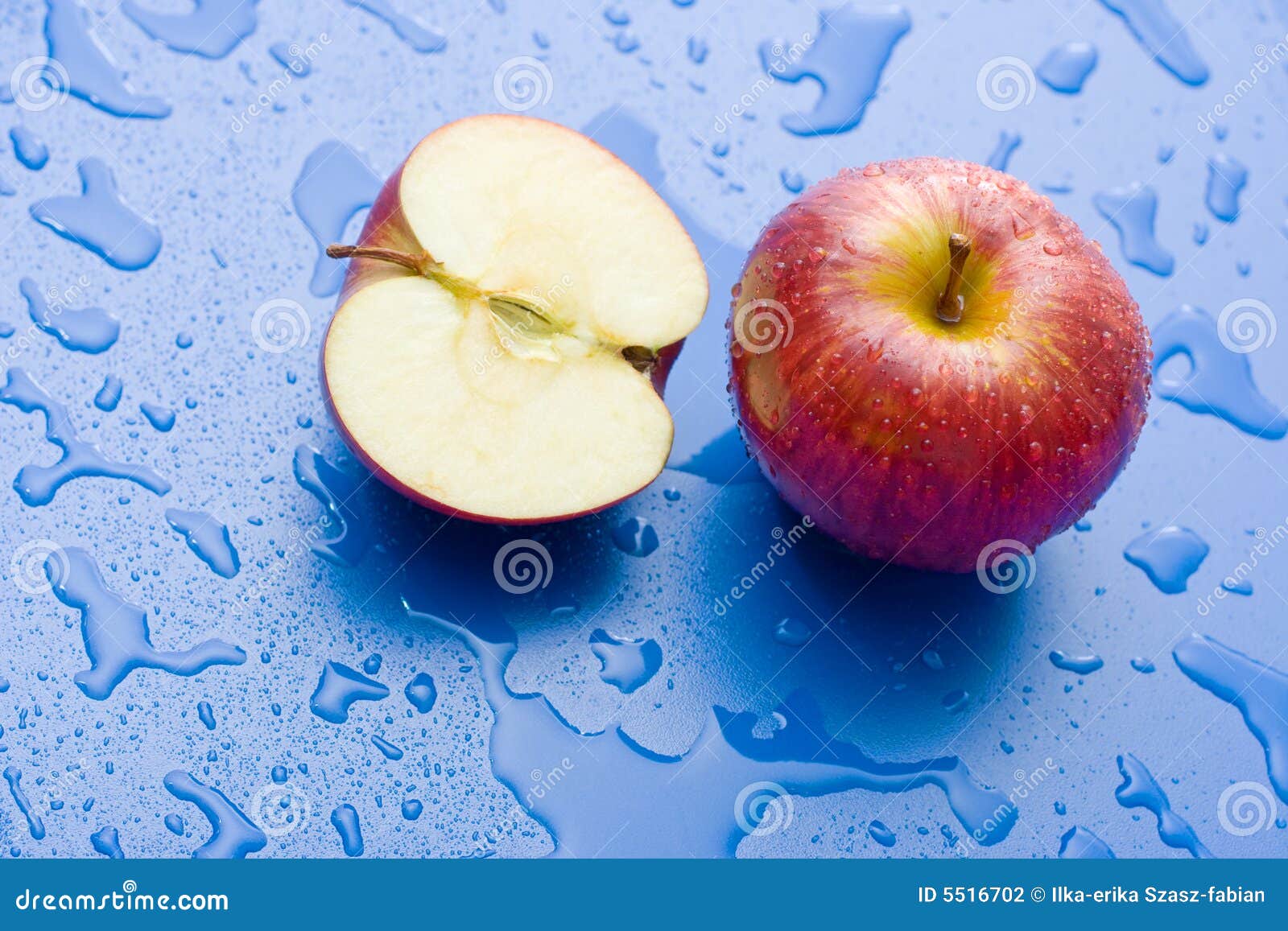 Half and whole apple stock photo. Image of blue, drops - 5516702