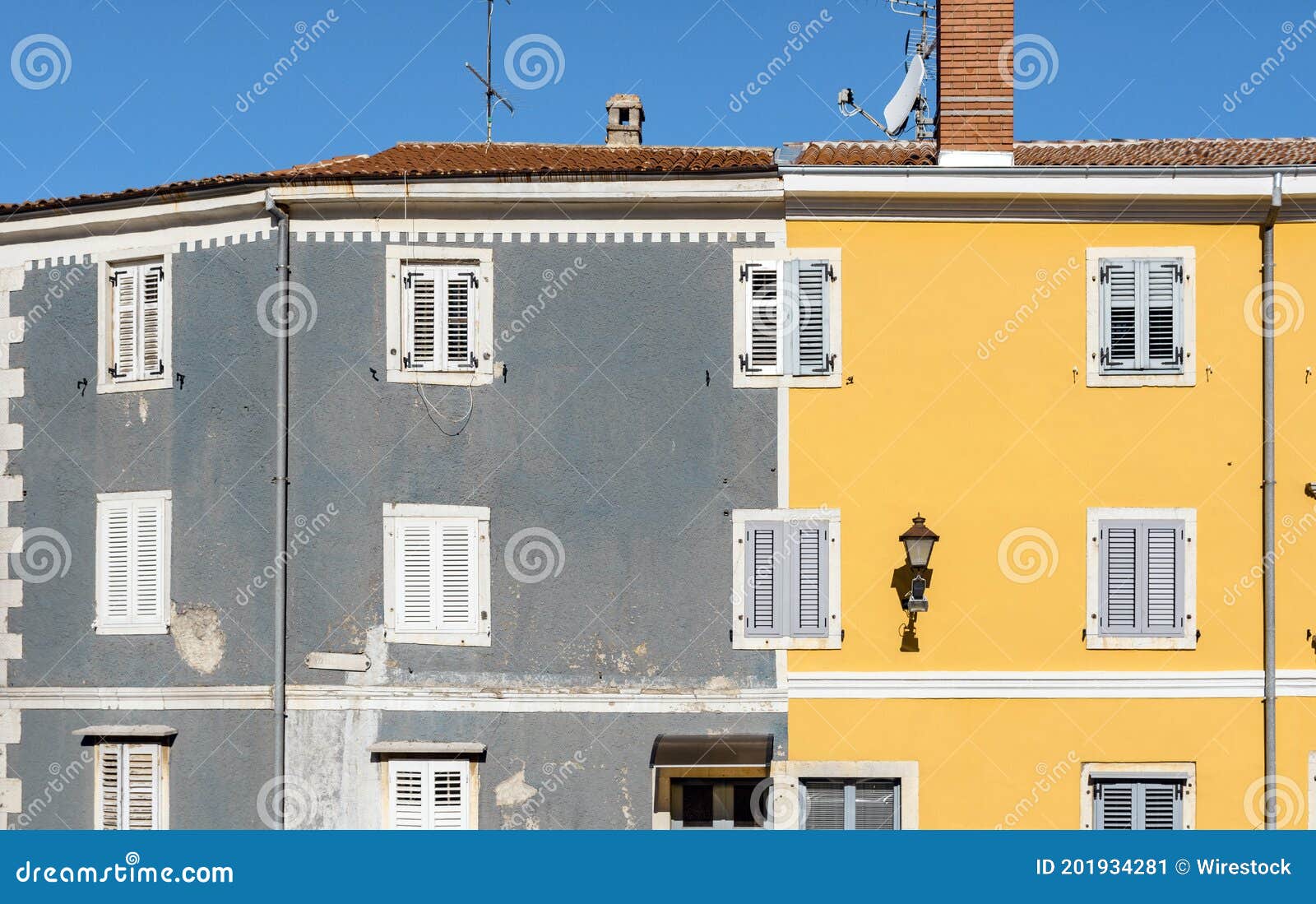 Half Yellow Half Gray Building with White Windows Stock Image - Image ...